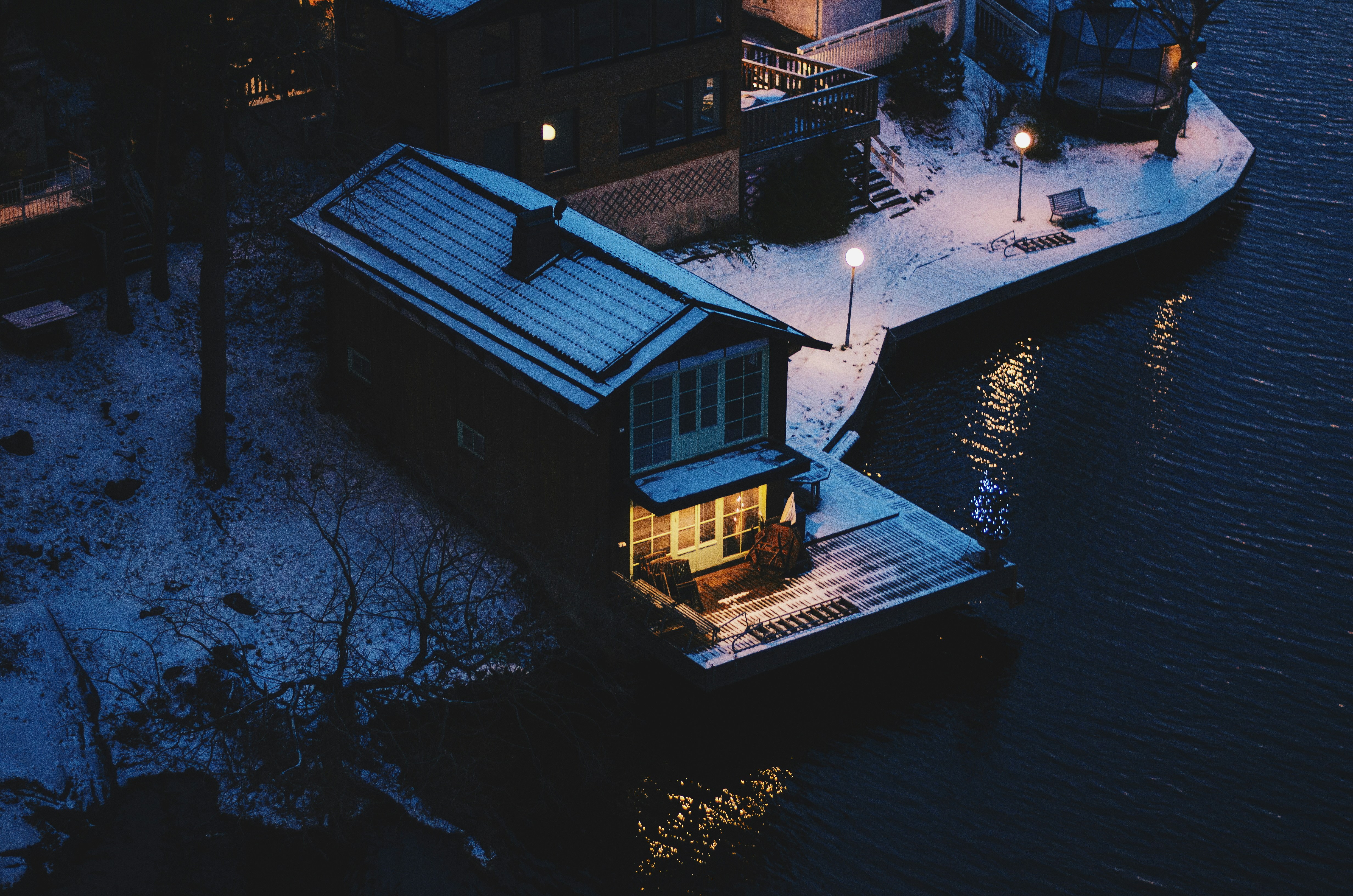 a boat dock with a house on top of it