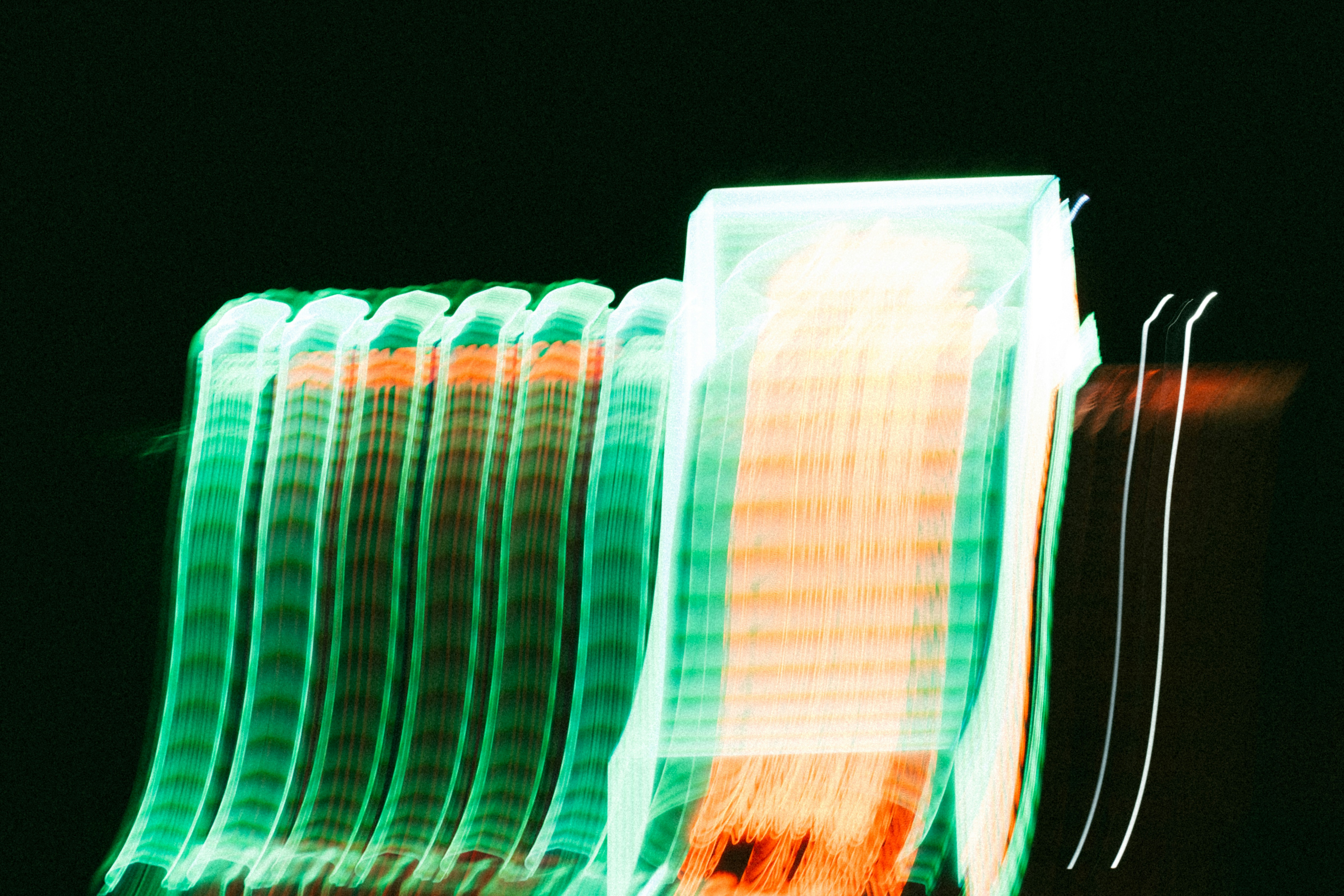 Green Neon Echoes: Night Sign Trails in Motion