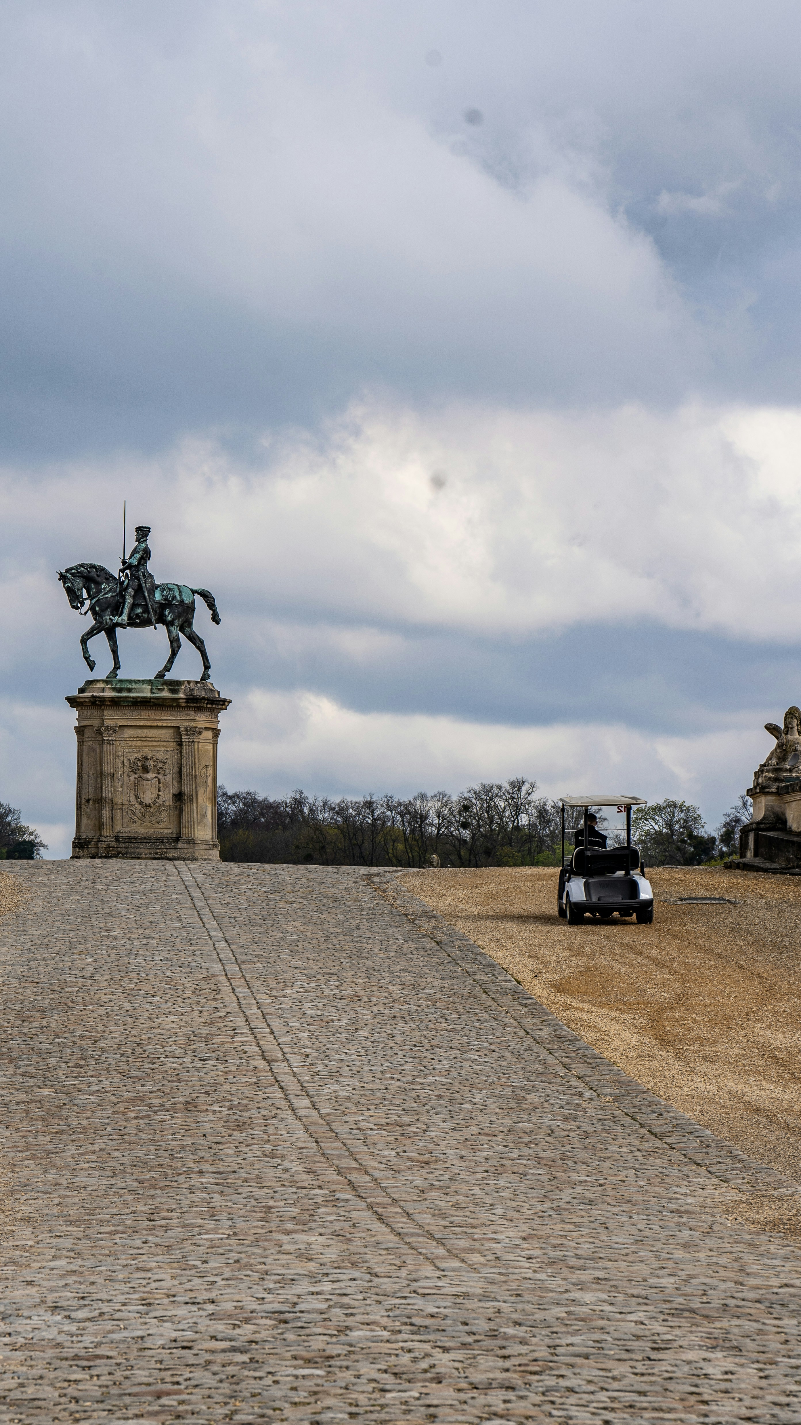 Equestrian Sentinel: A Monumental Pathway Under Wide Sky