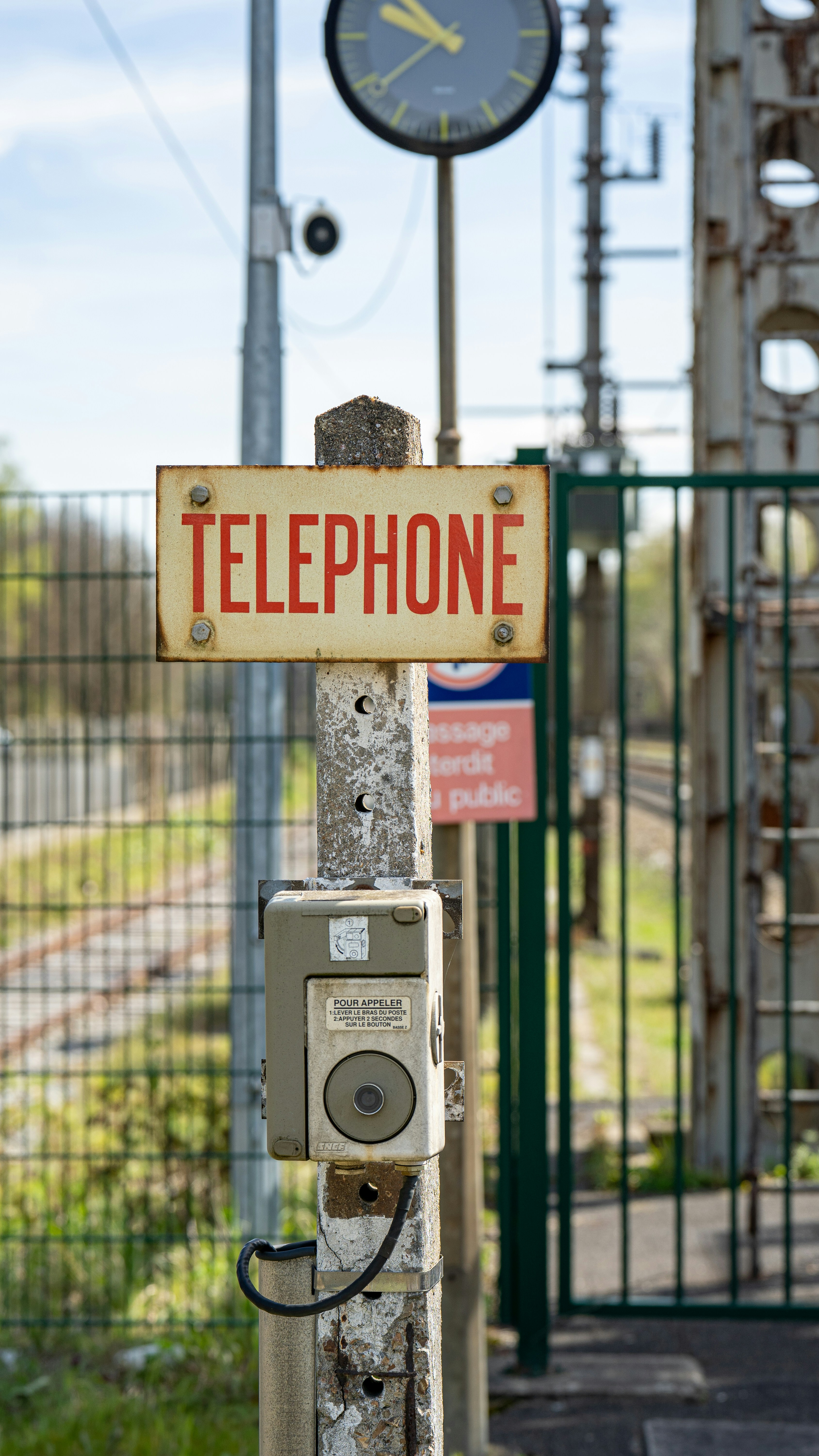 A telephone pole with a sign attached to it photo – Free Call center ...