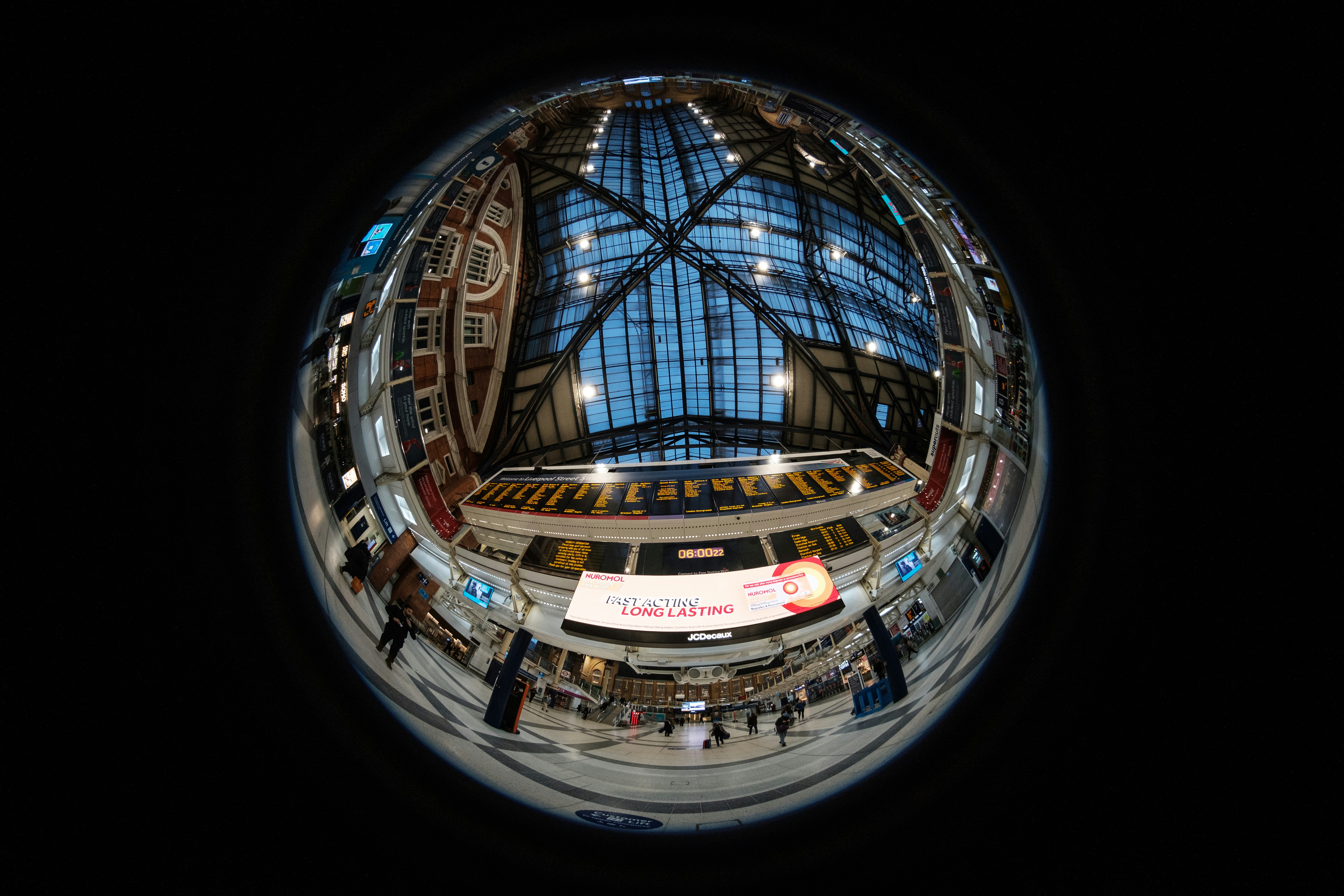 A fish eye view of a train station photo – Free Human Image on Unsplash