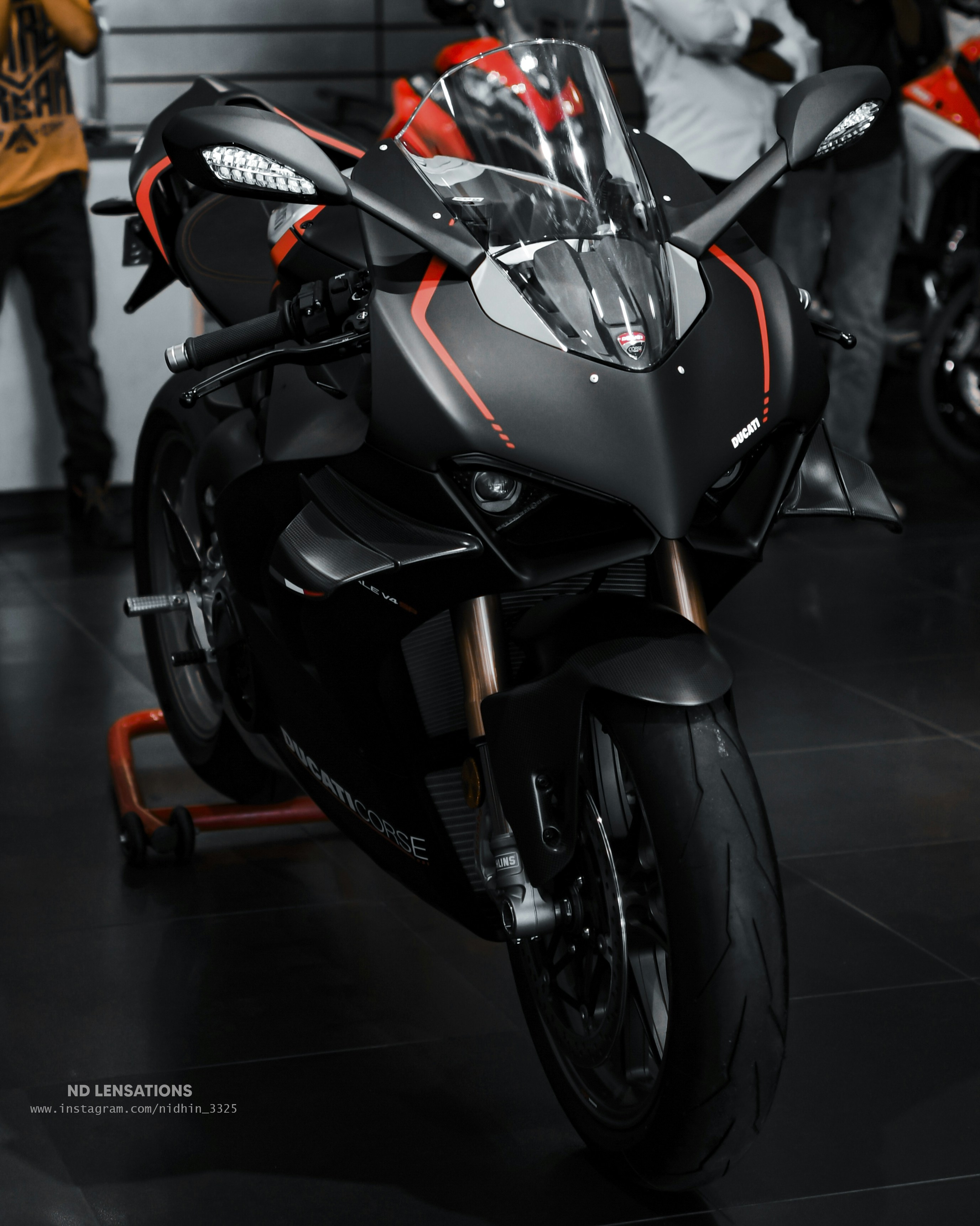 A black and red motorcycle on display at a show photo – Free Ducati ...