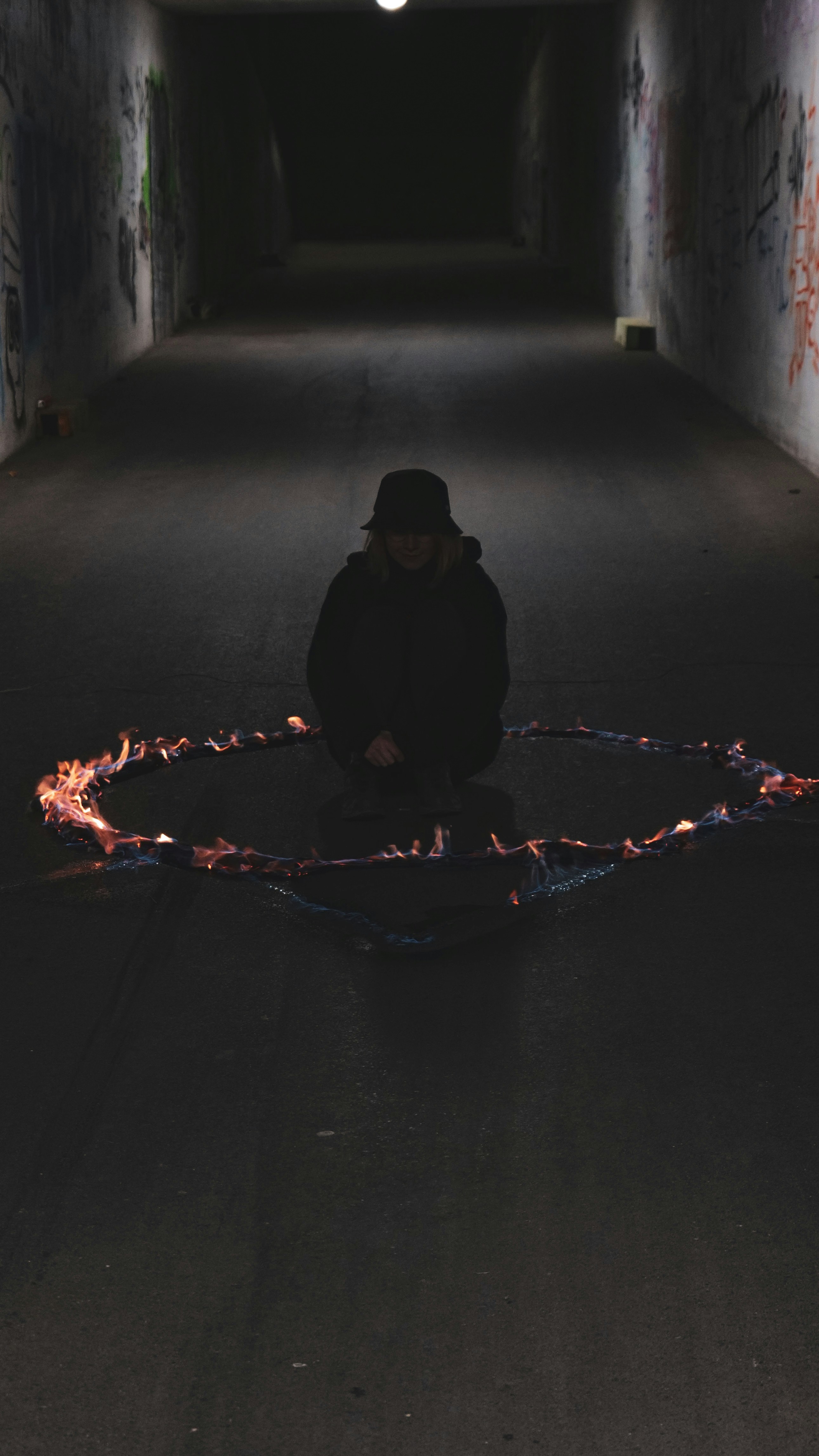 Shrink the Ring: A Shadowed Figure in a Ring of Firelight