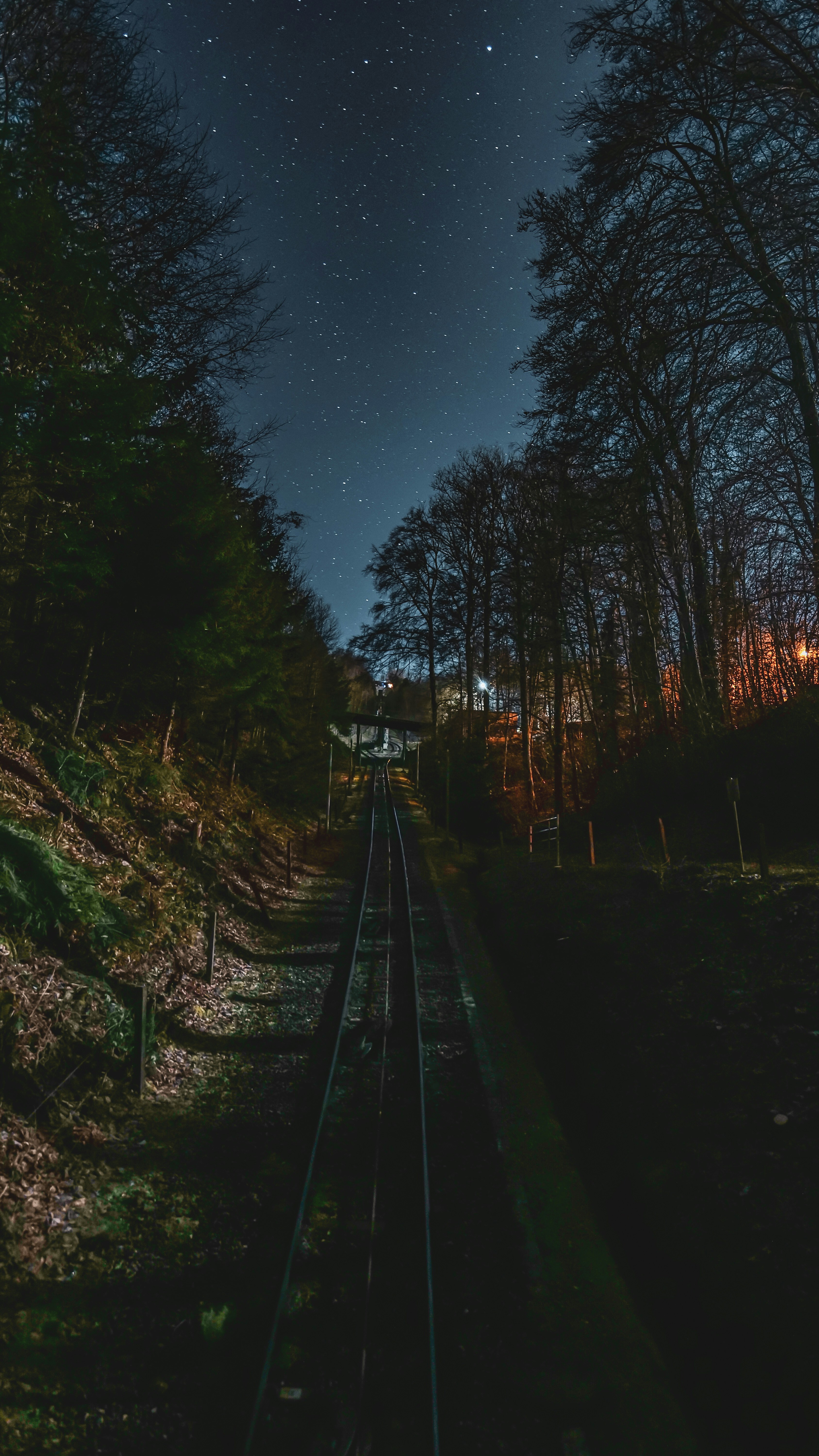 A train track under a night sky with stars photo – Free Grey Image on ...