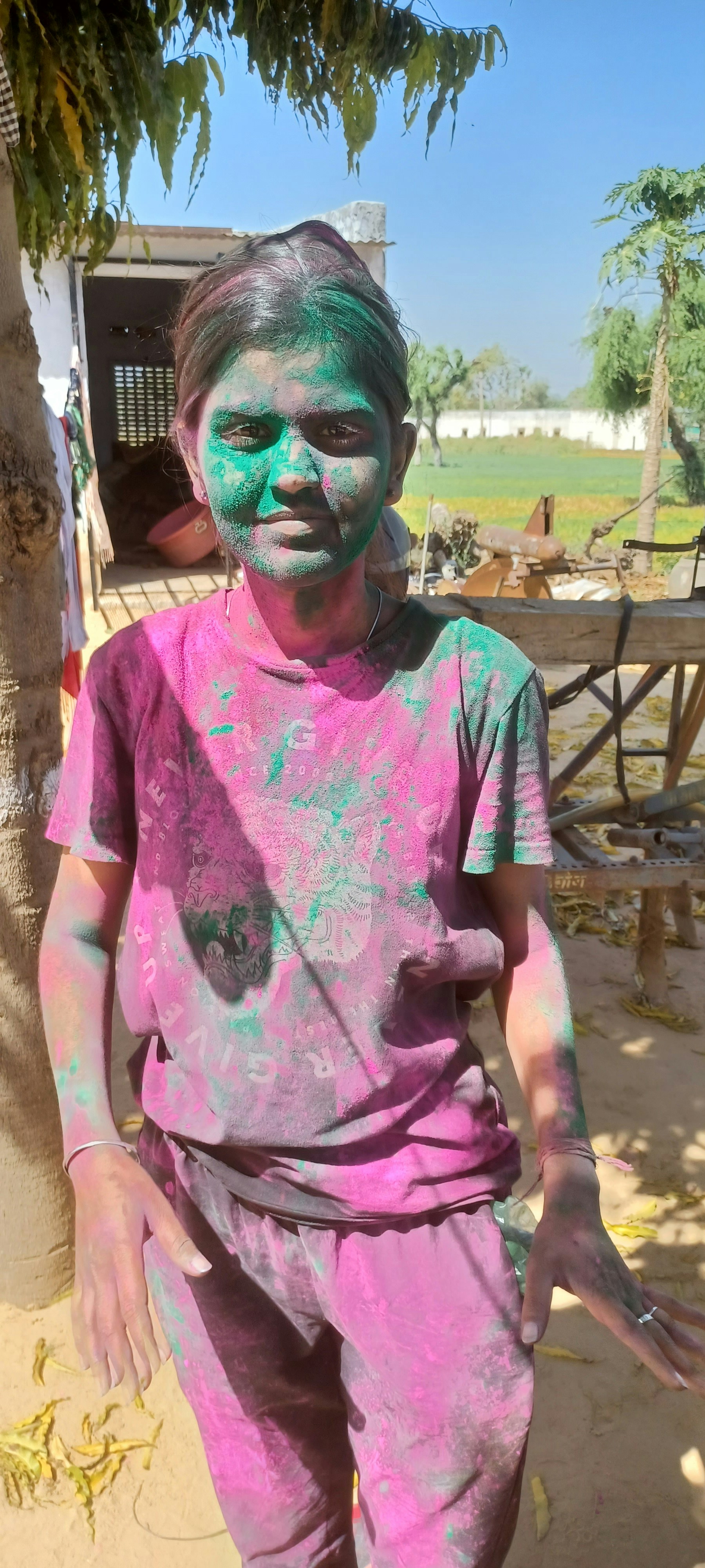 A person with green and blue paint on their face photo – Free Woman ...