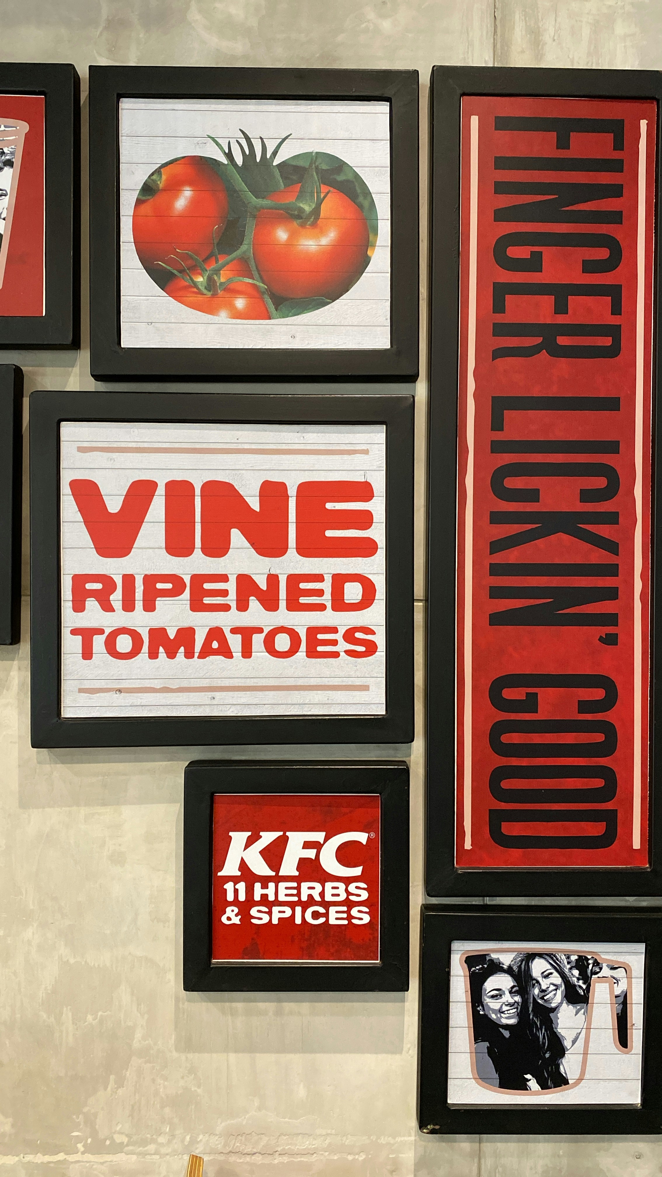 Tomato Still Life Amid a Wall of Flavor: Framed Typography and Brand Signals