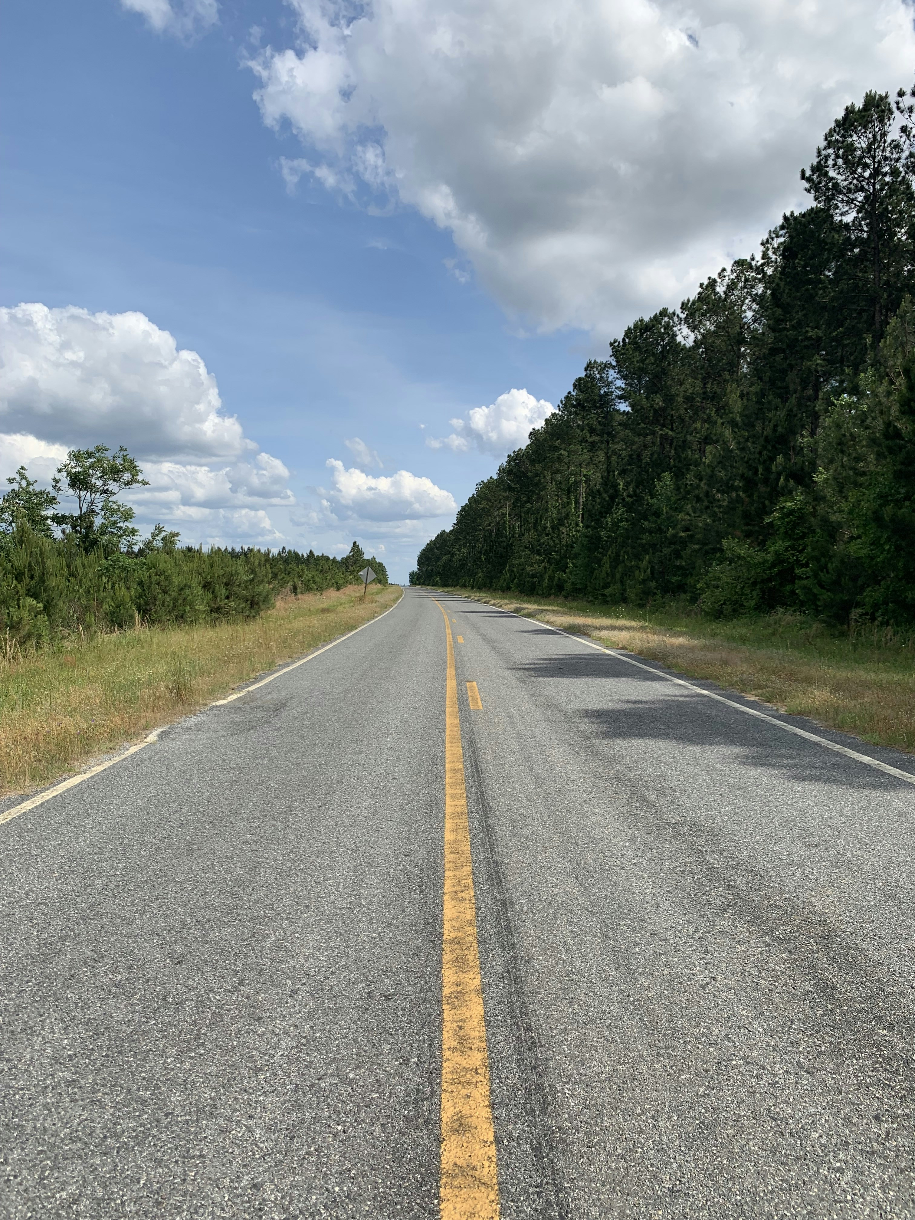 An empty road with a yellow line on the side photo – Free Usa Image on ...