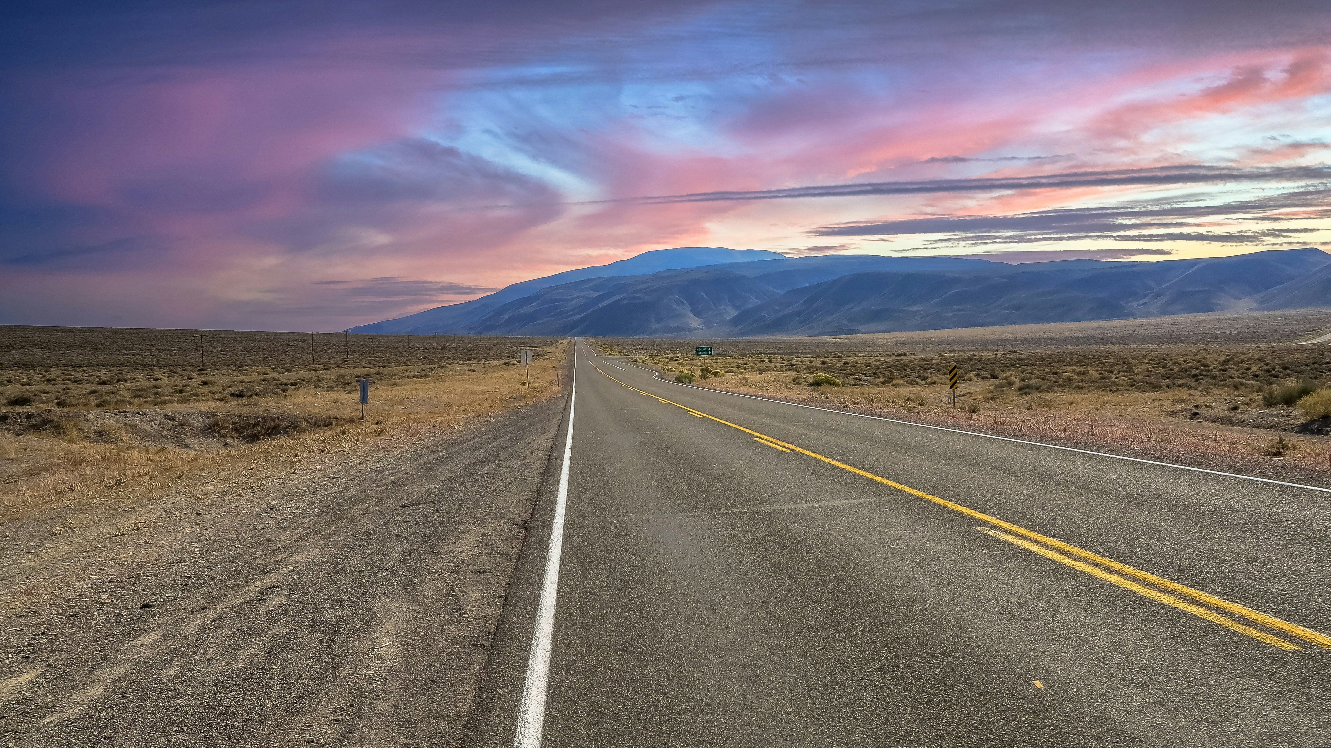 A long empty road with mountains in the background photo – Free Nevada ...