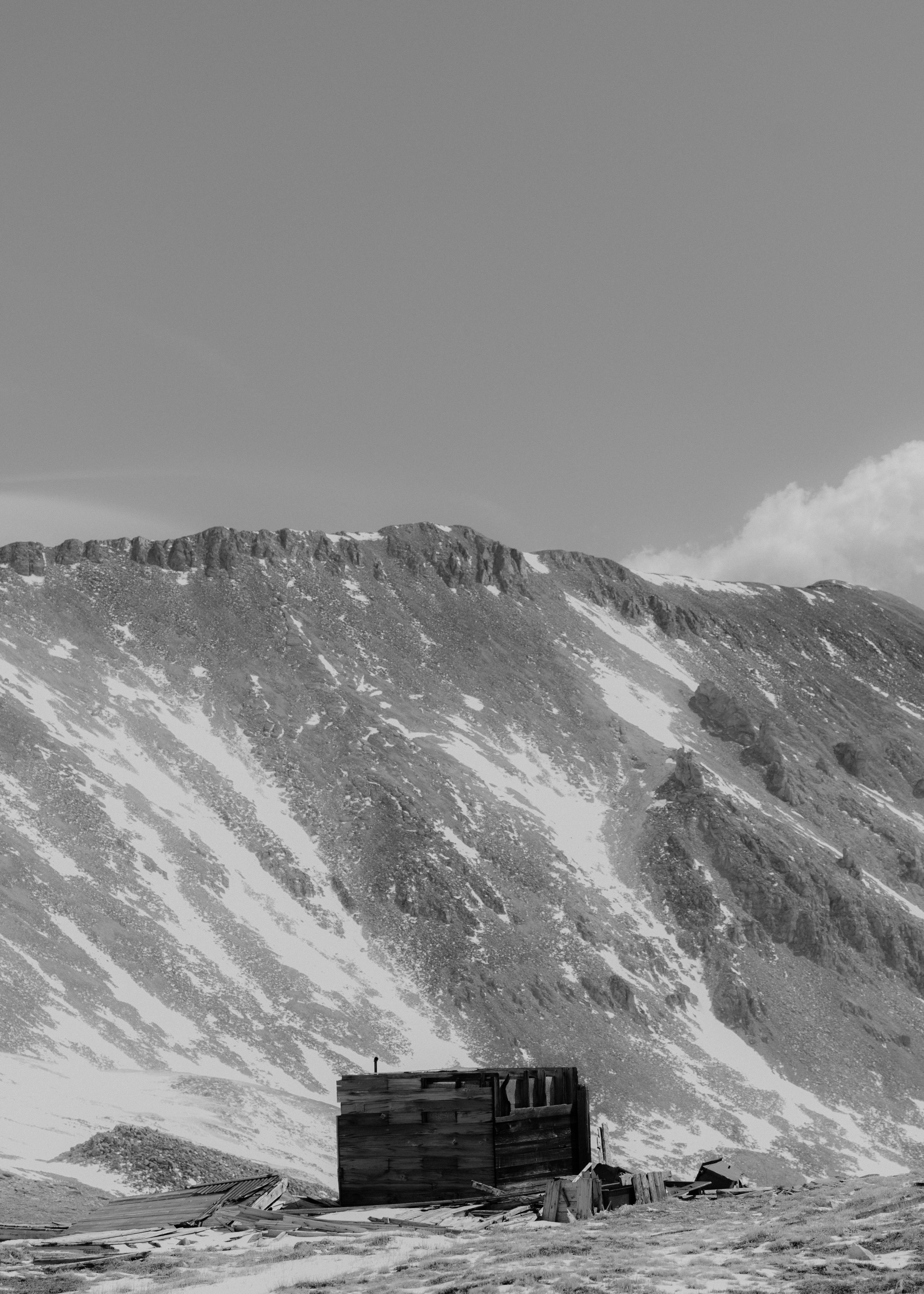Snowbound Hut at the Edge of a Striated Ridge
