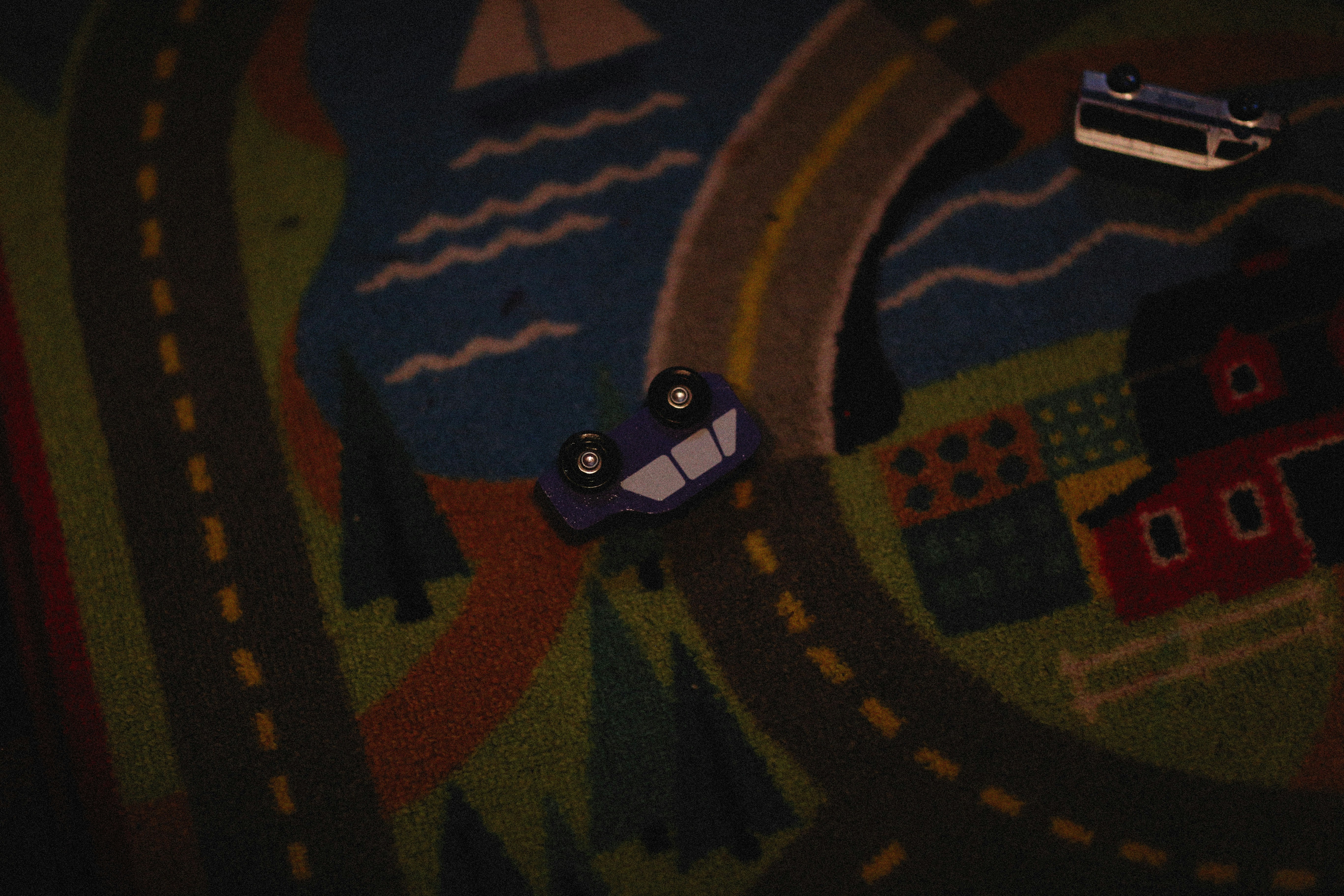 Tiny Cars on a Colorful Rug: A Quiet Playtime Moment