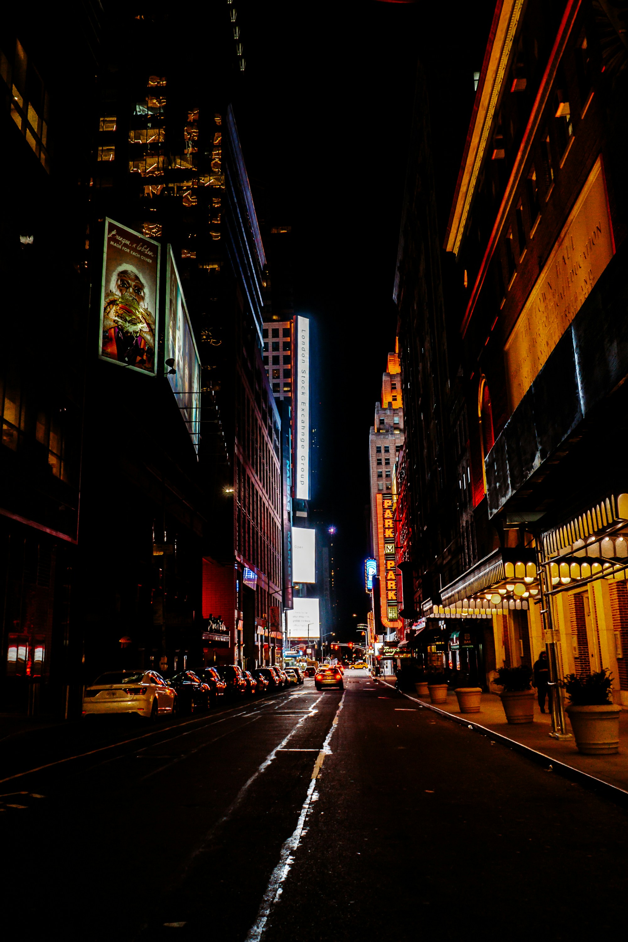 A city street at night with tall buildings photo – Free Usa Image on ...