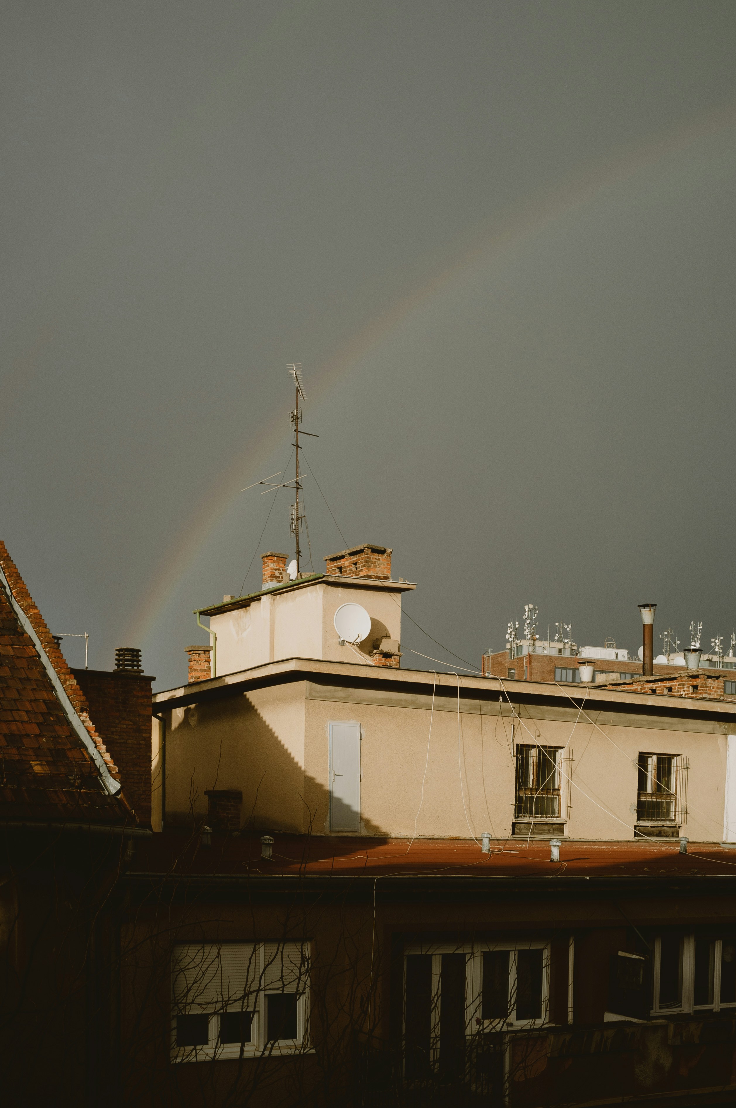 Rainbow Over Rooftops: A Quiet City Moment