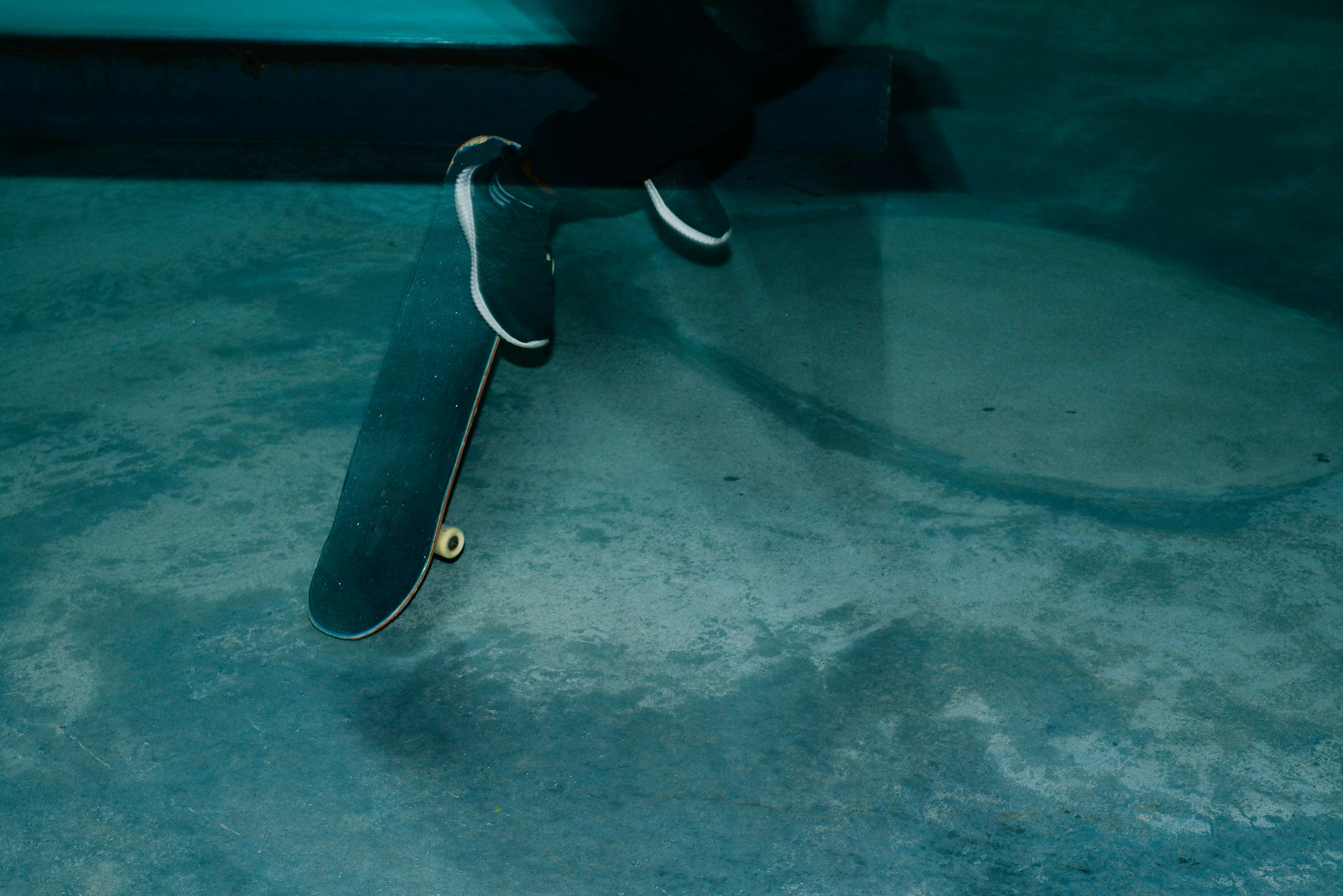 a skateboard is laying on the ground in a room