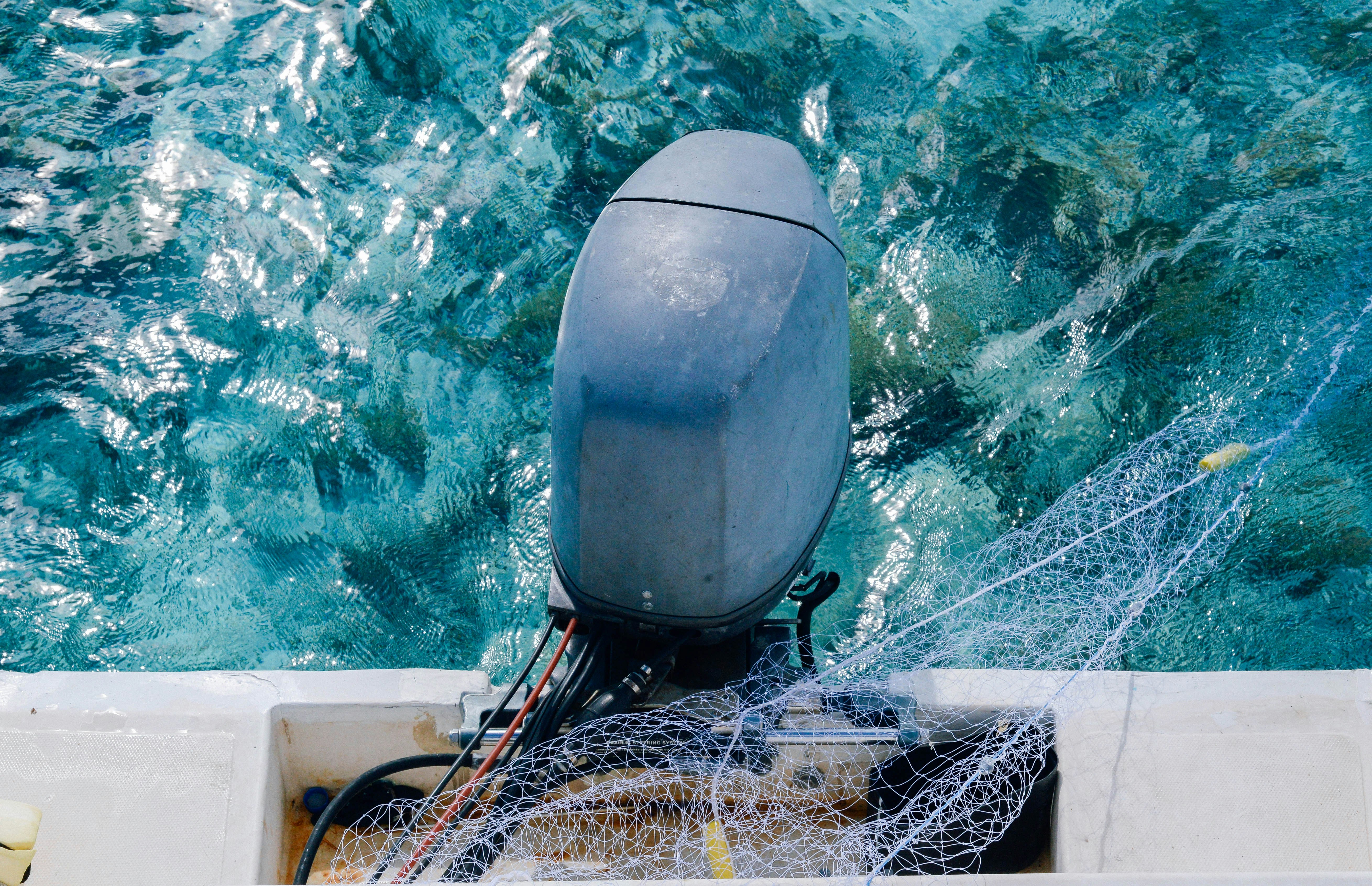 Outboard Engine Elevates a Quiet Morning on Blue-green Water