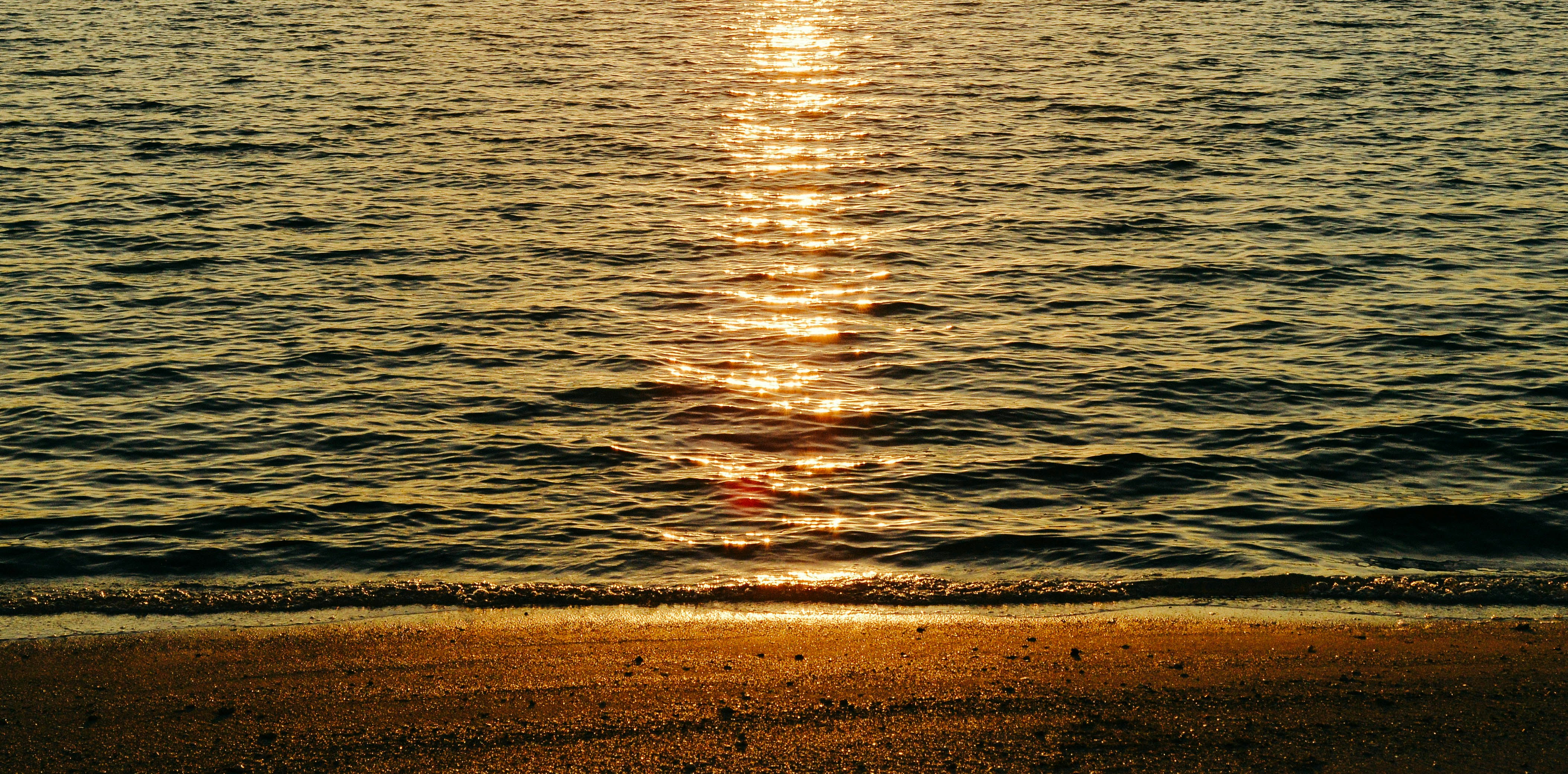 Slender Sunset Ribbon Over a Quiet Seashore