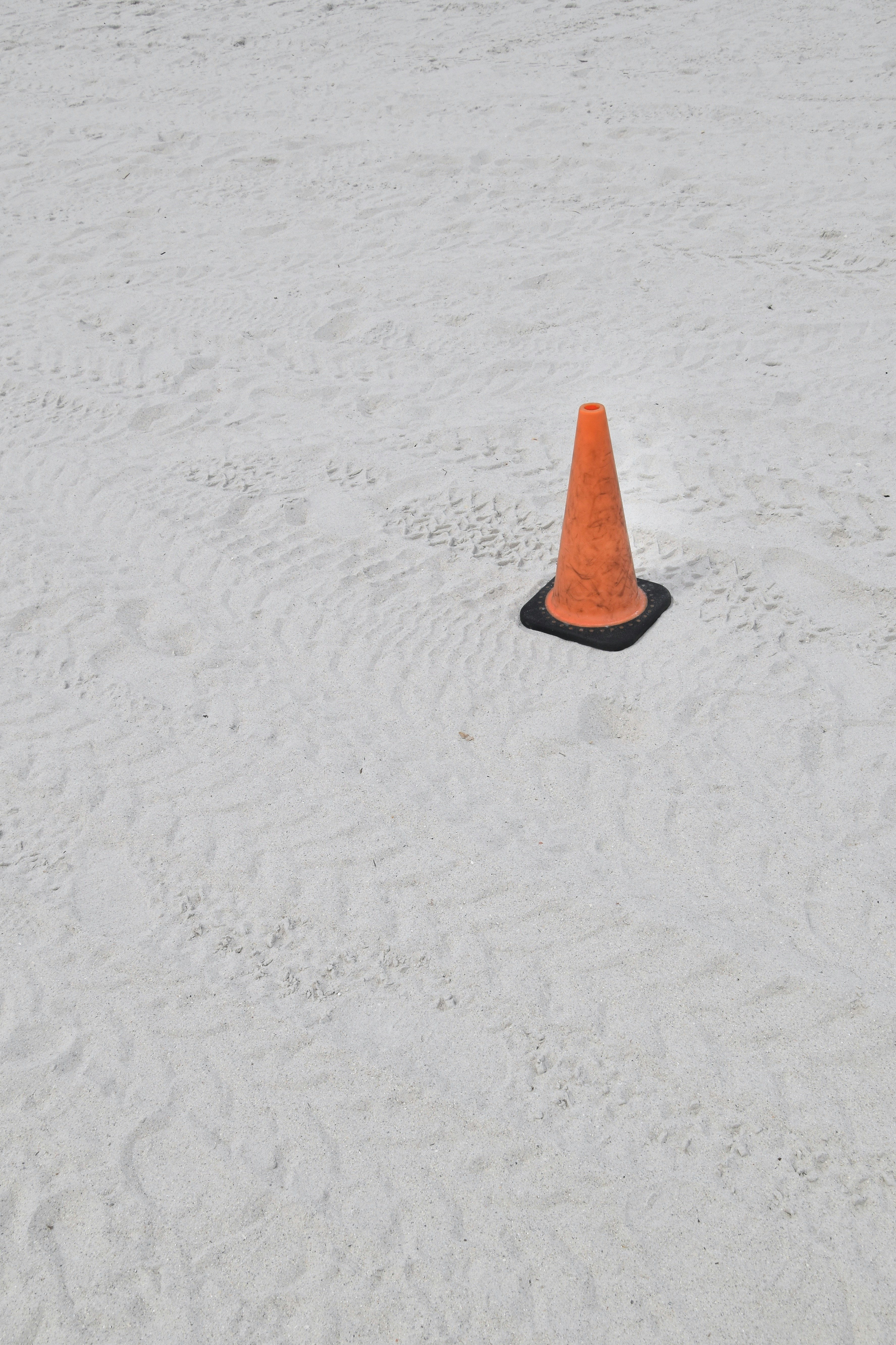 Cone in a Sea of Sand: A Minimalist Safety Marker