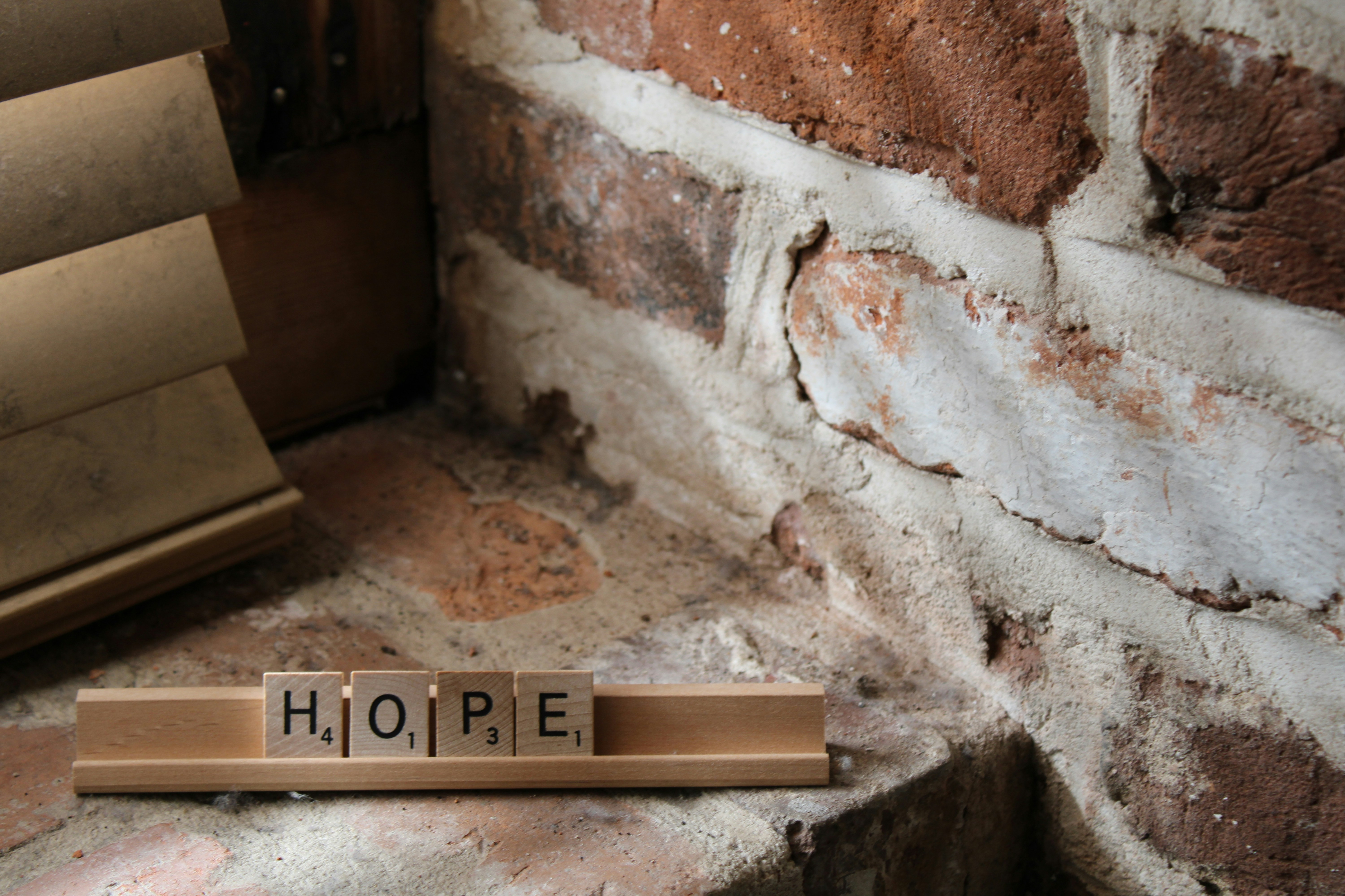 A scrabble type scrabble block with the word hope written on it photo ...