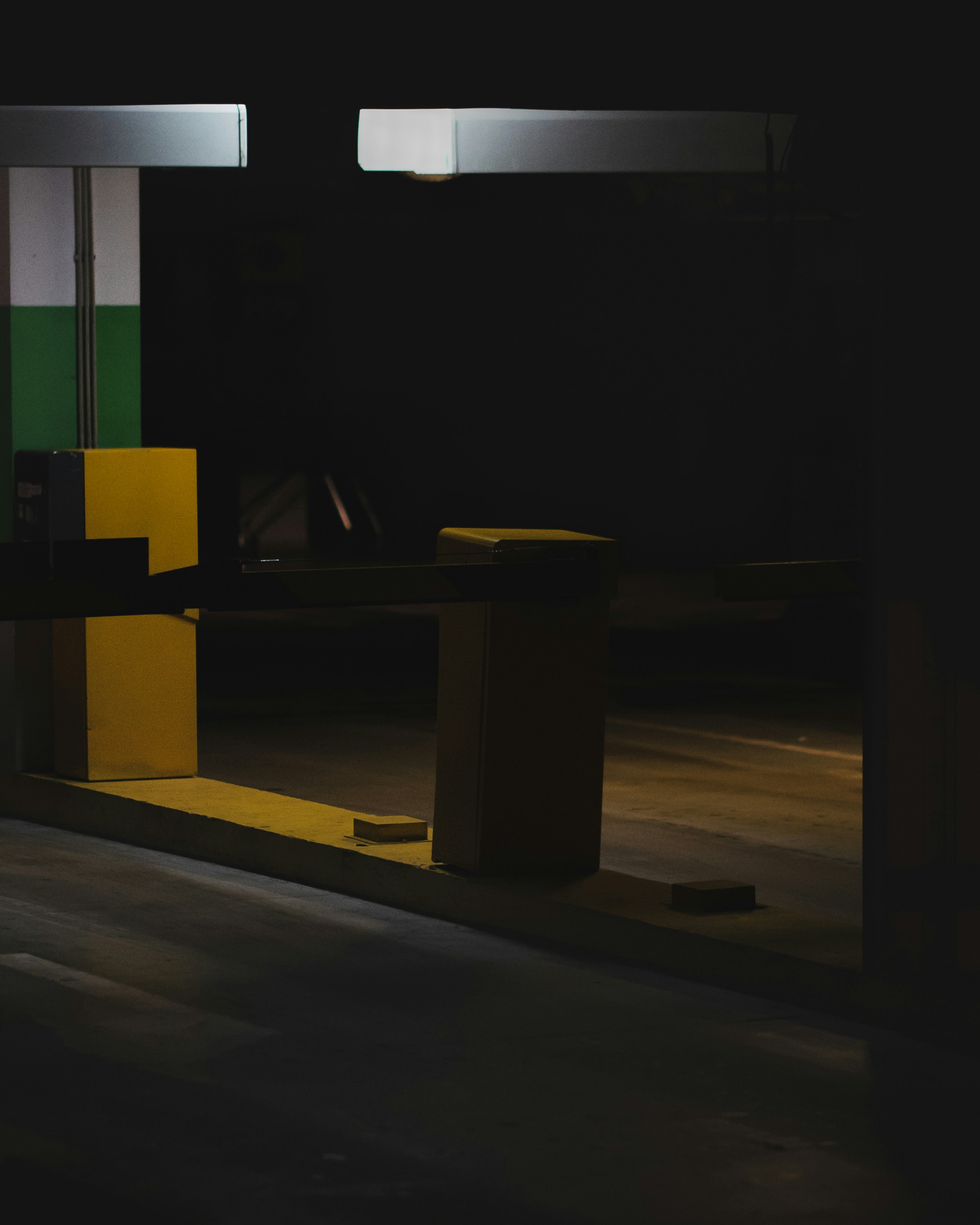 A dark room with yellow and green boxes on the floor photo – Free ...