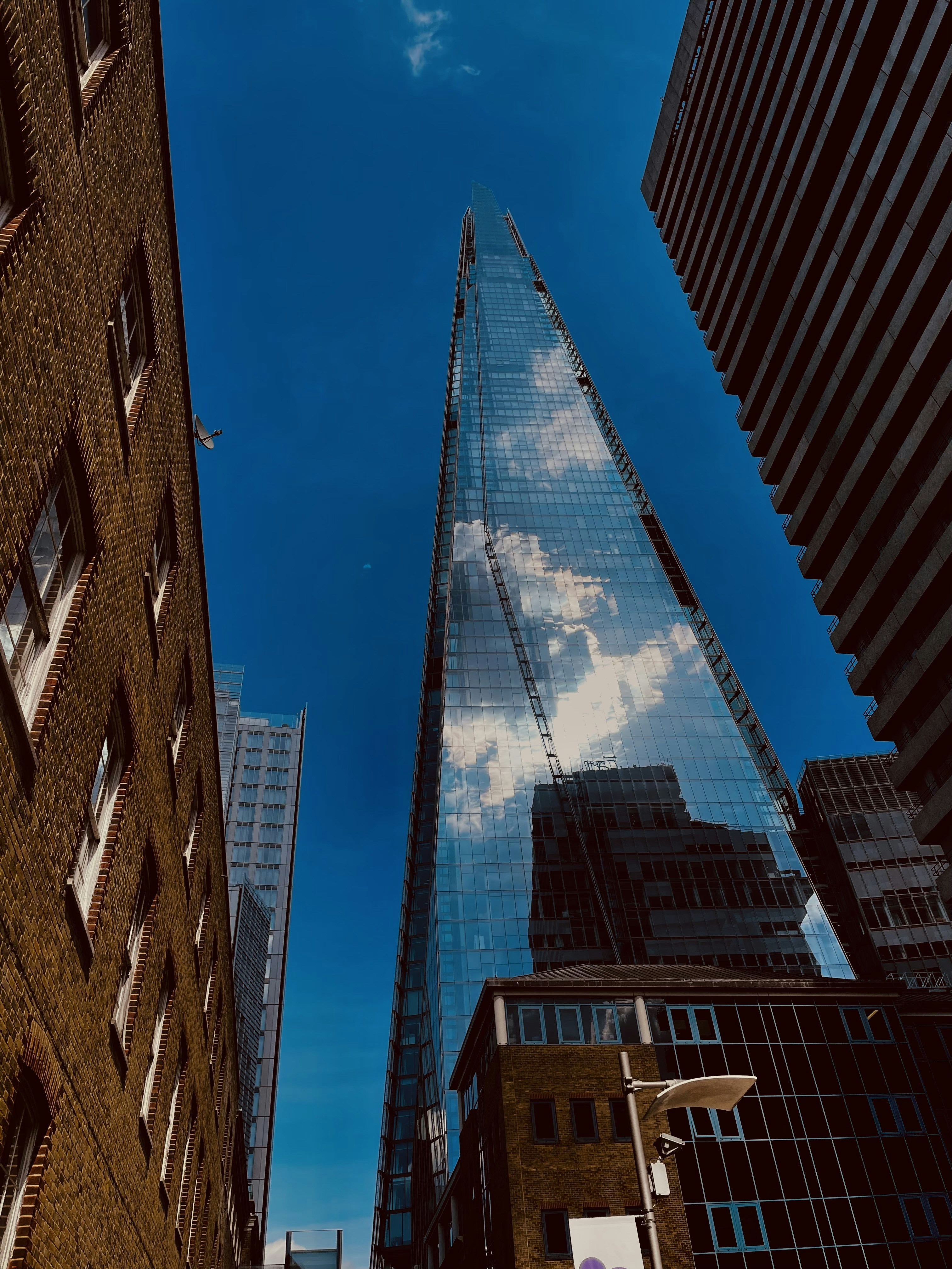 A very tall building next to other tall buildings photo – Free London ...