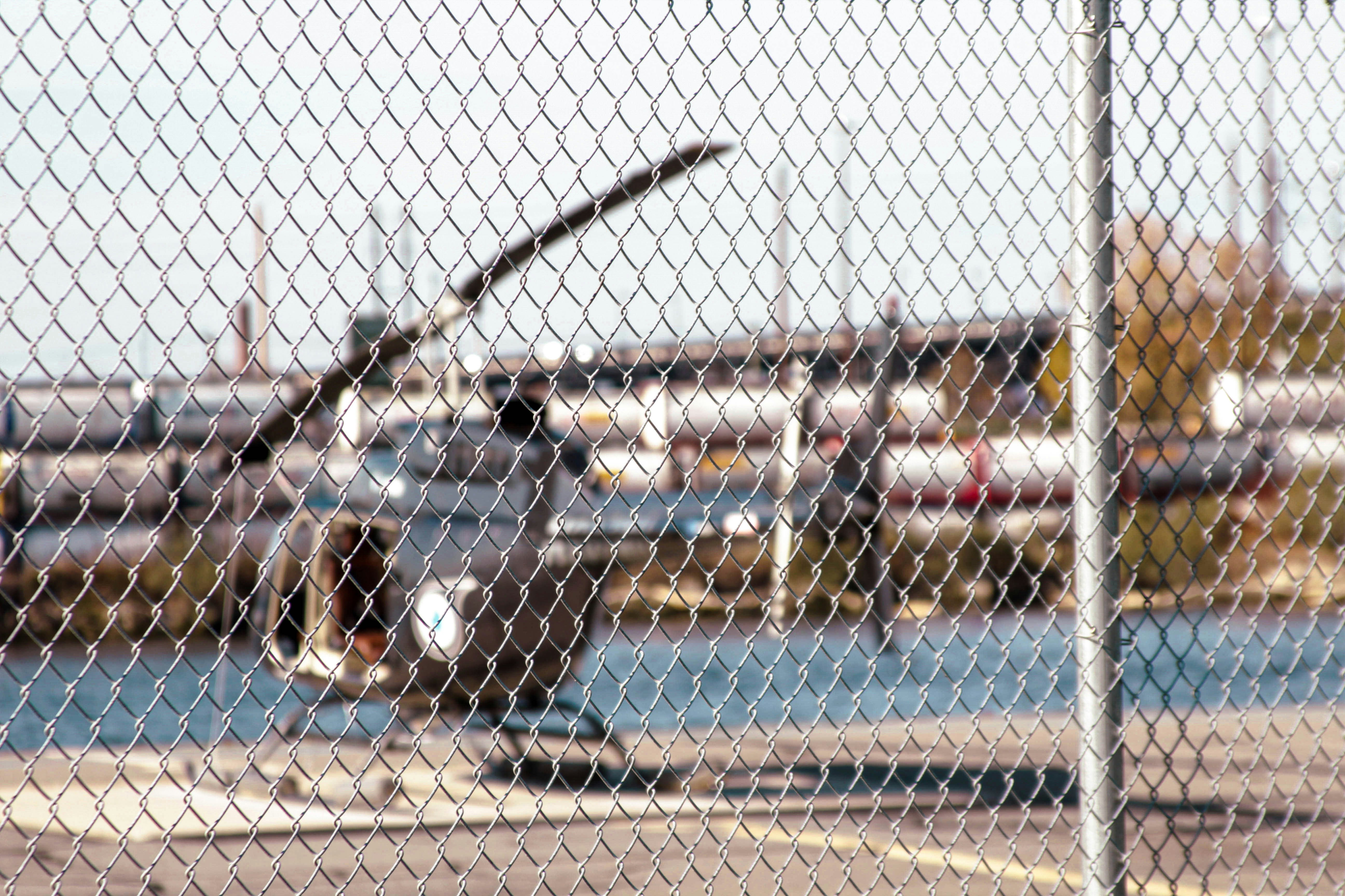 A man riding a skateboard on top of a tennis court photo – Free New ...