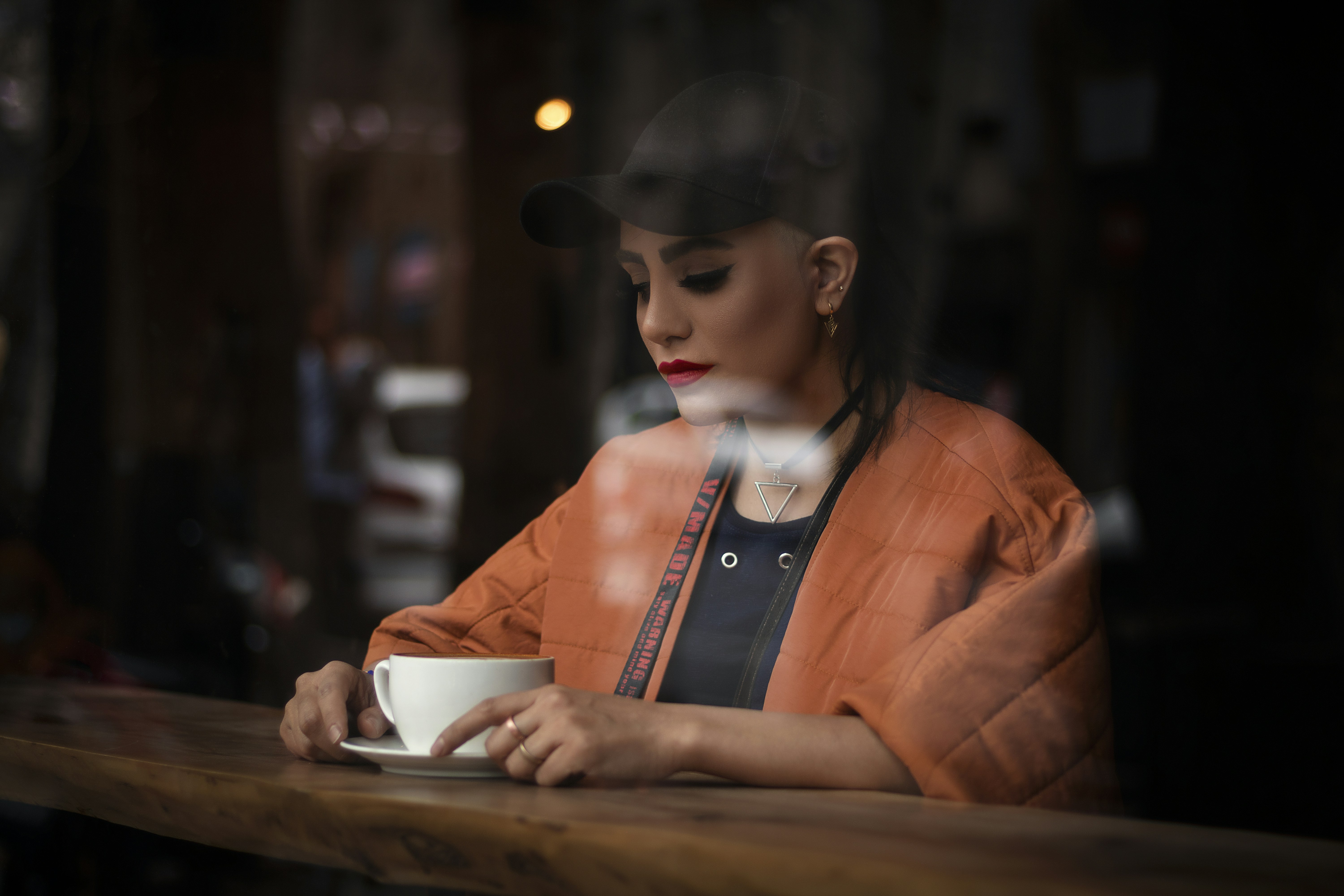 Amber Window Portrait: Quiet Focus at a Café