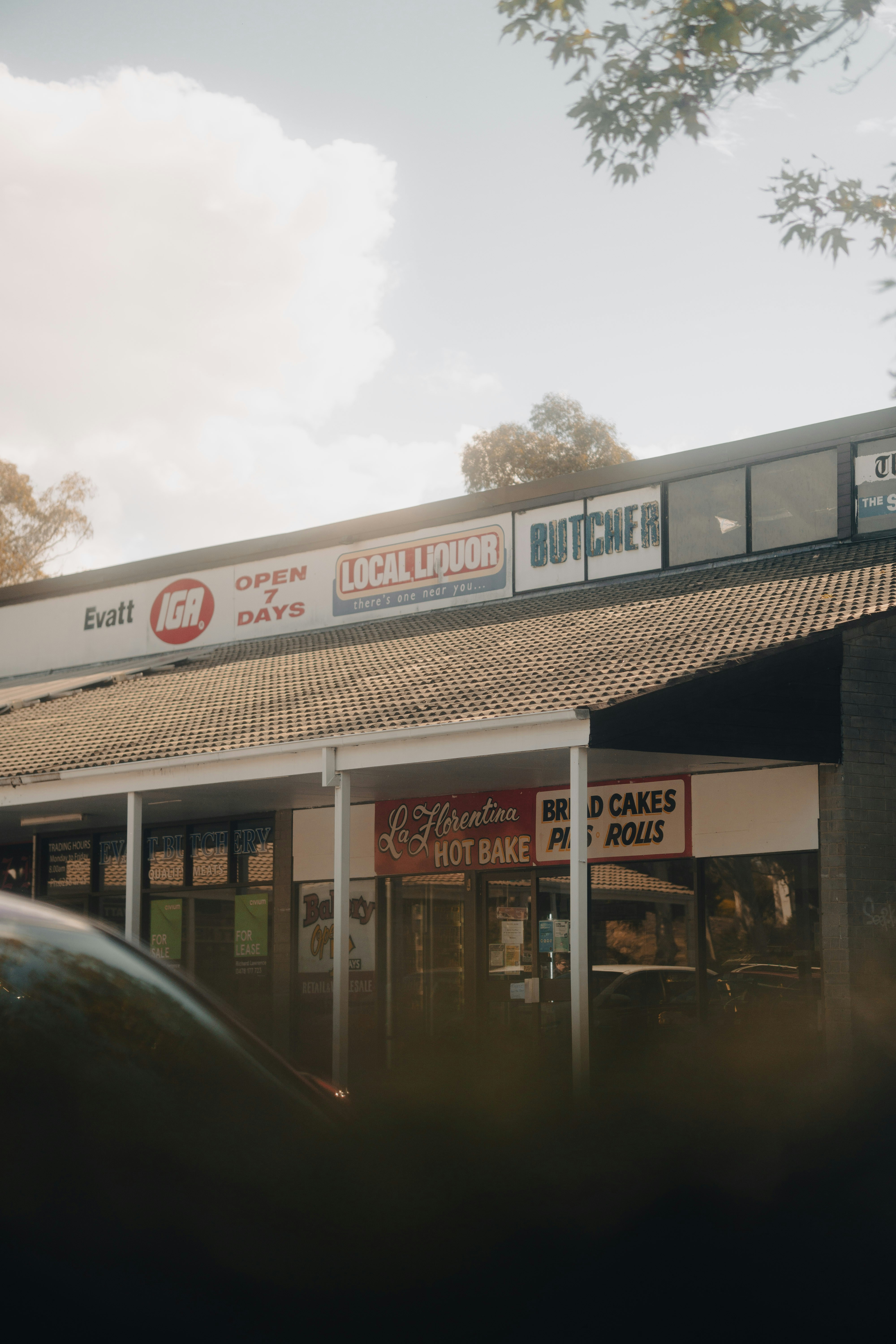 Shopfront Signage Under a Calm Sky
