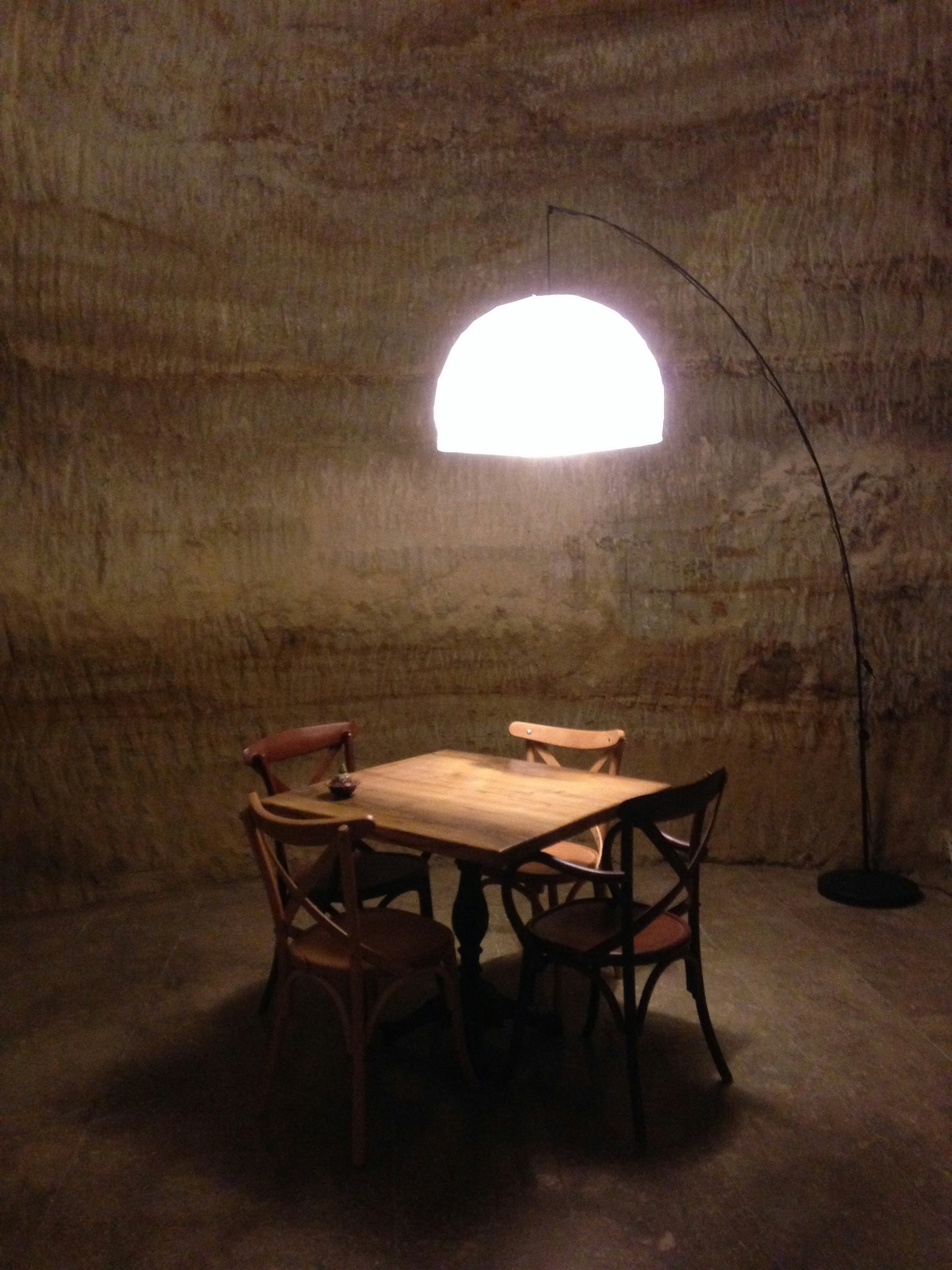 Halo Above the Rustic Table in an Underground Chamber