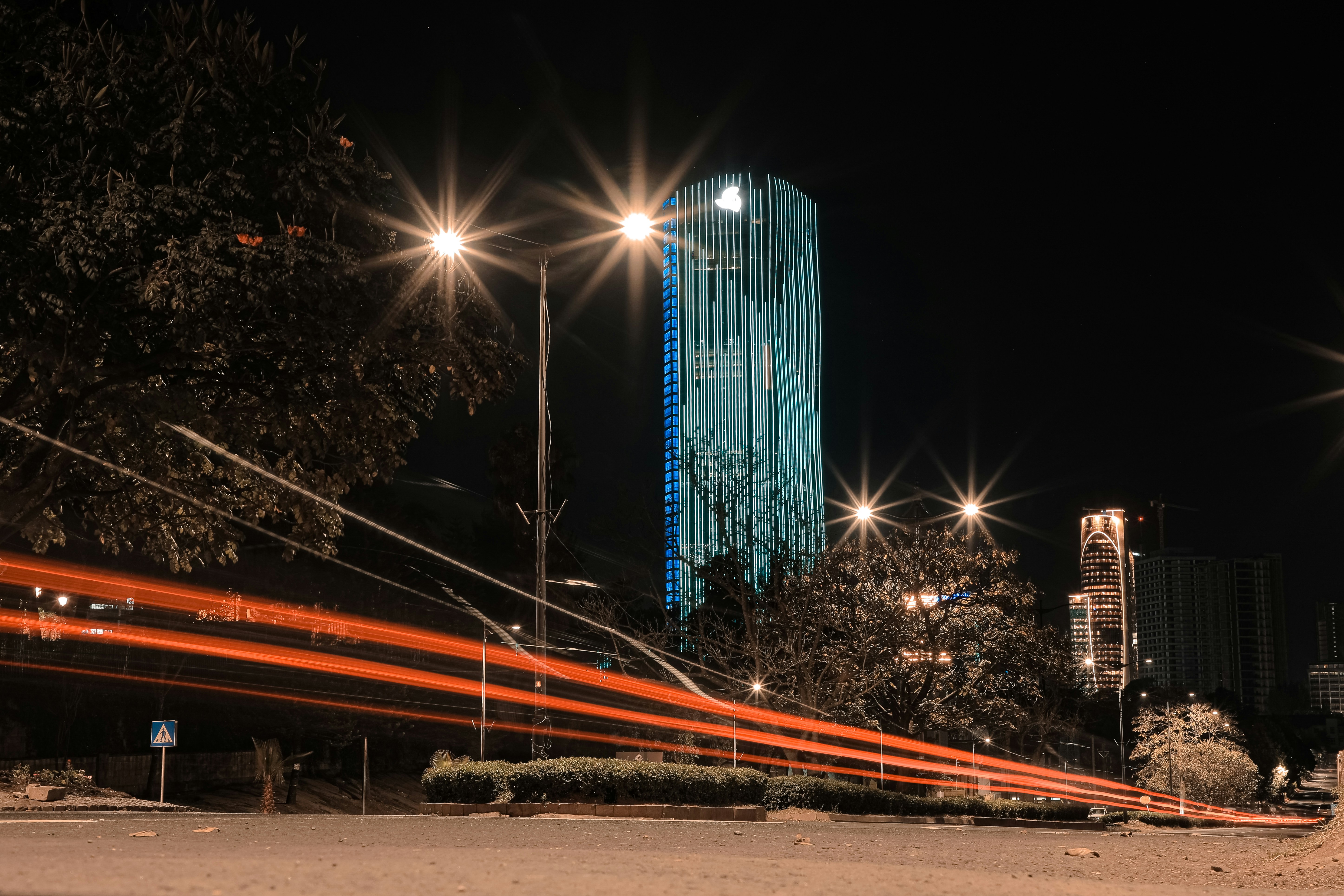 A city street at night with street lights photo – Free Addis ababa ...