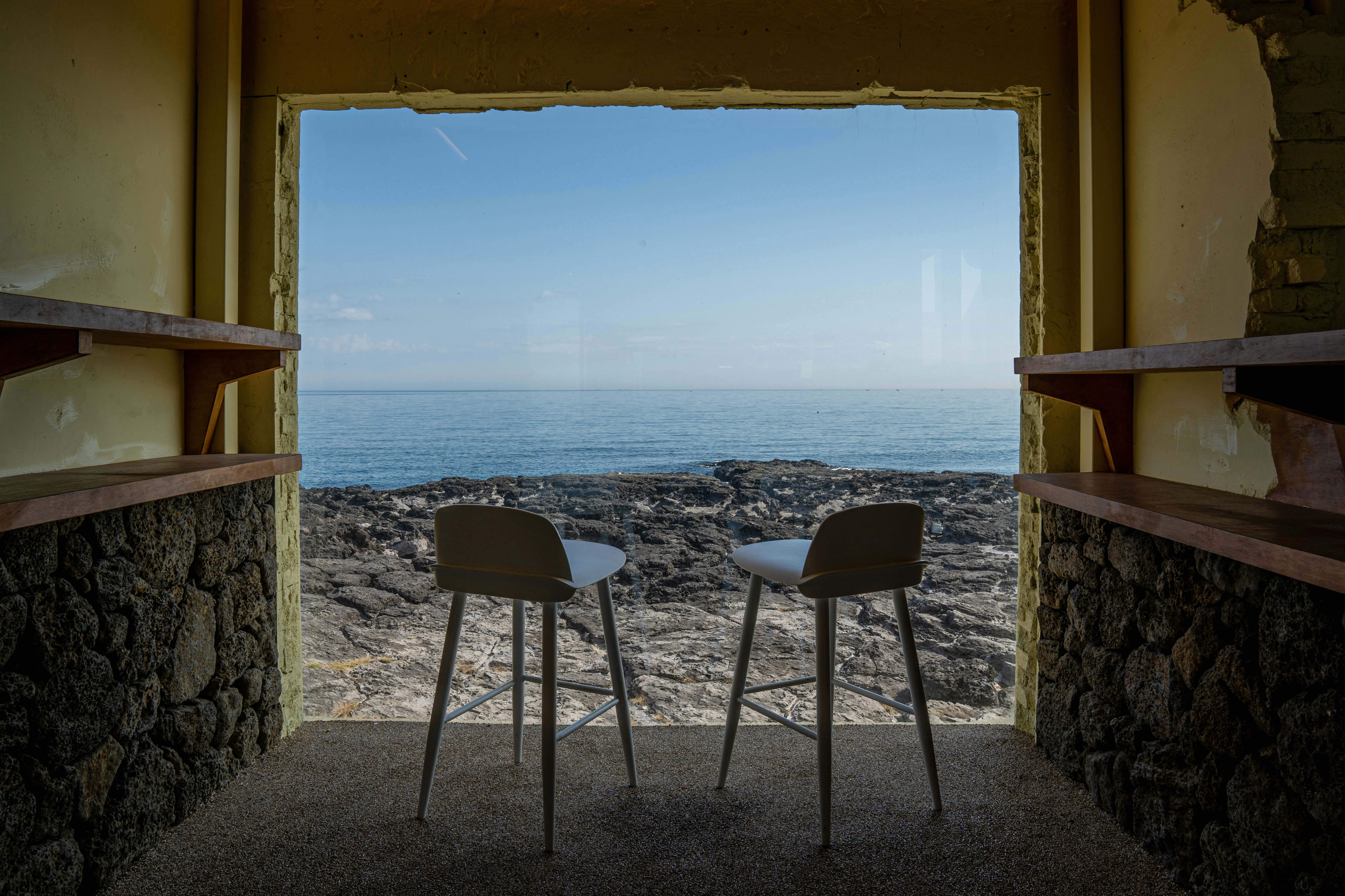 Sea View from a Cove: Two Chairs Facing the Horizon
