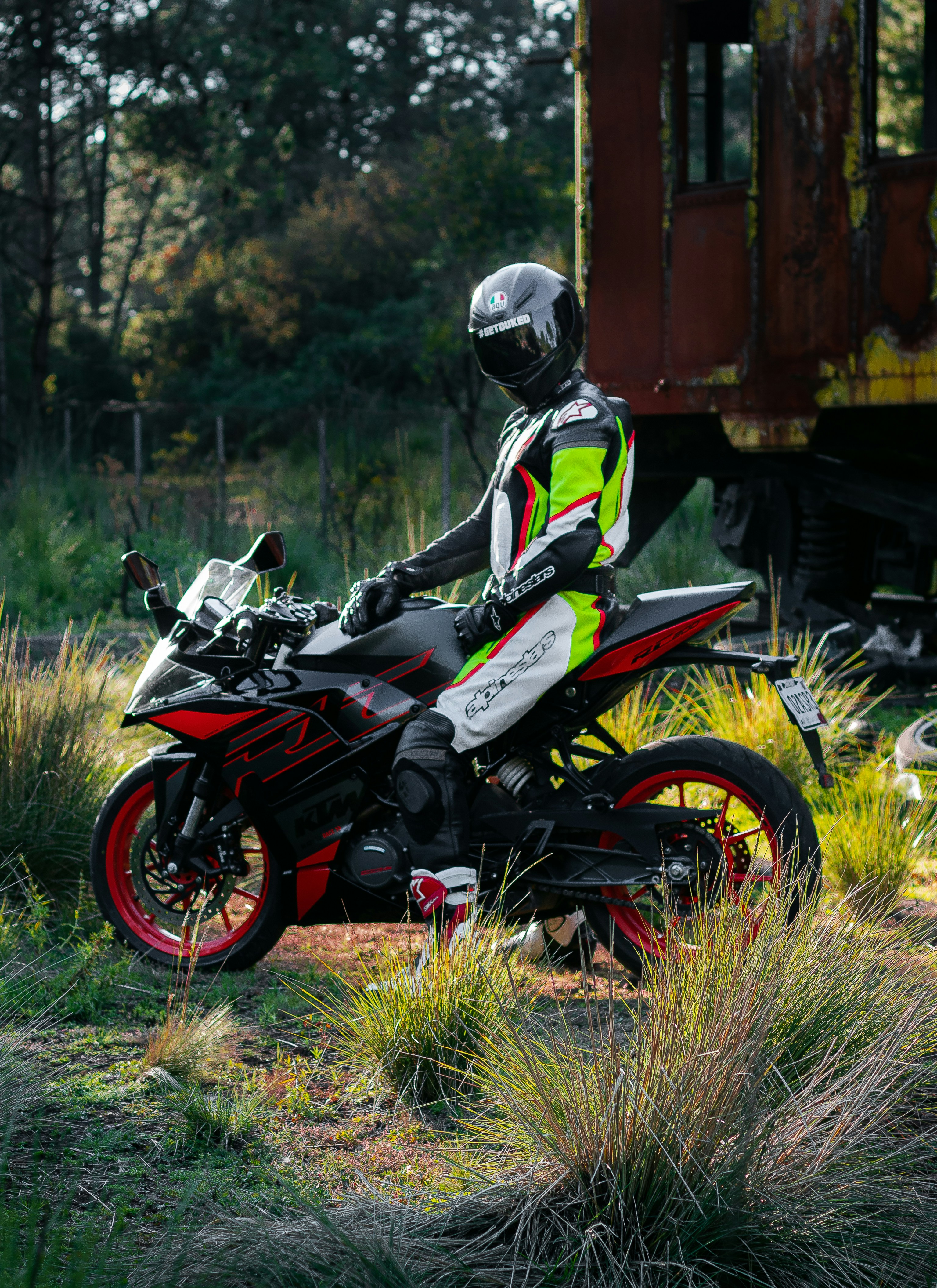 Neon-Accented Rider on a Red-Trimmed Street Bike by Distant Tracks