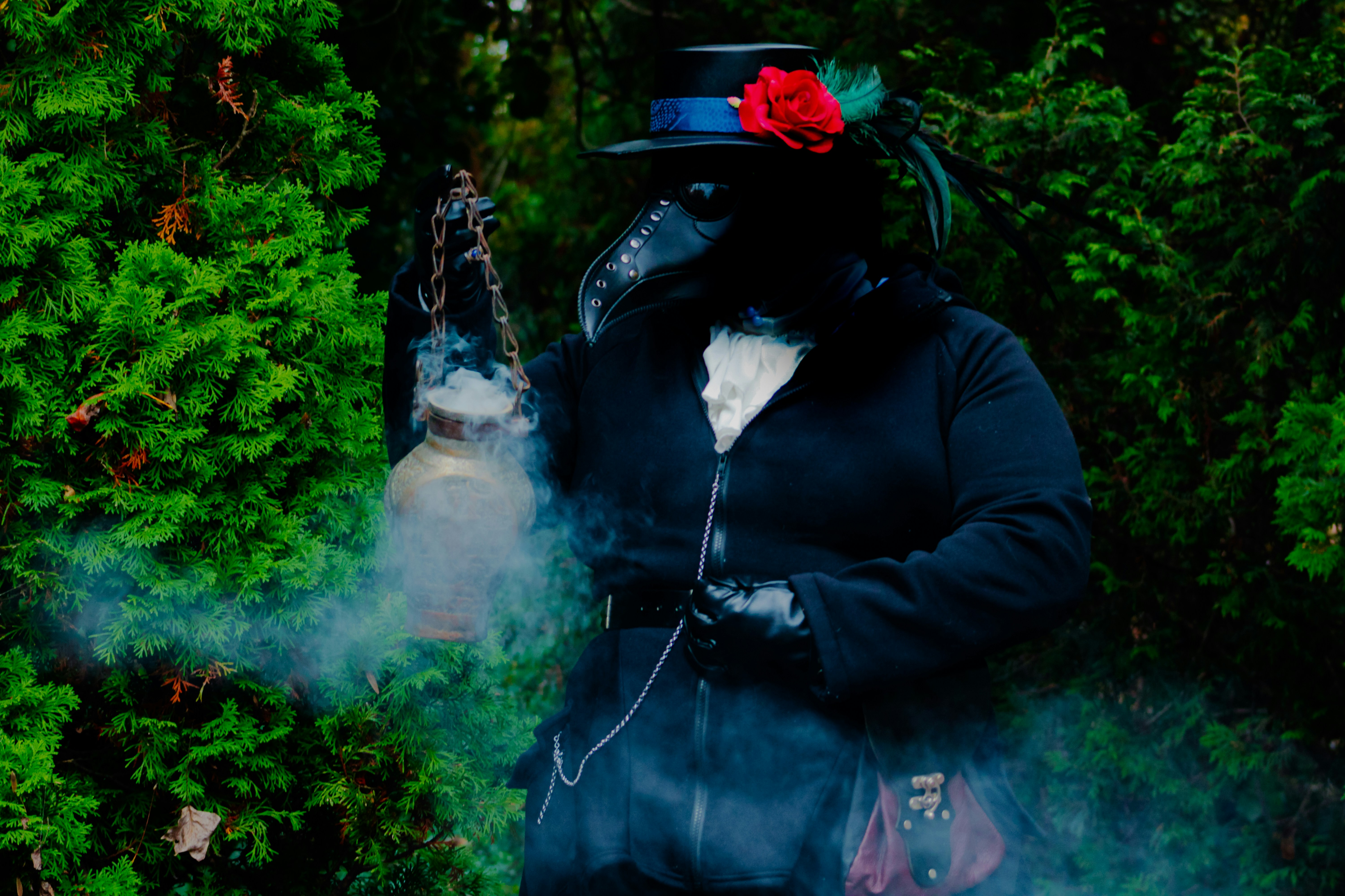 A person in a costume with a rose on their head photo – Free Theatre ...