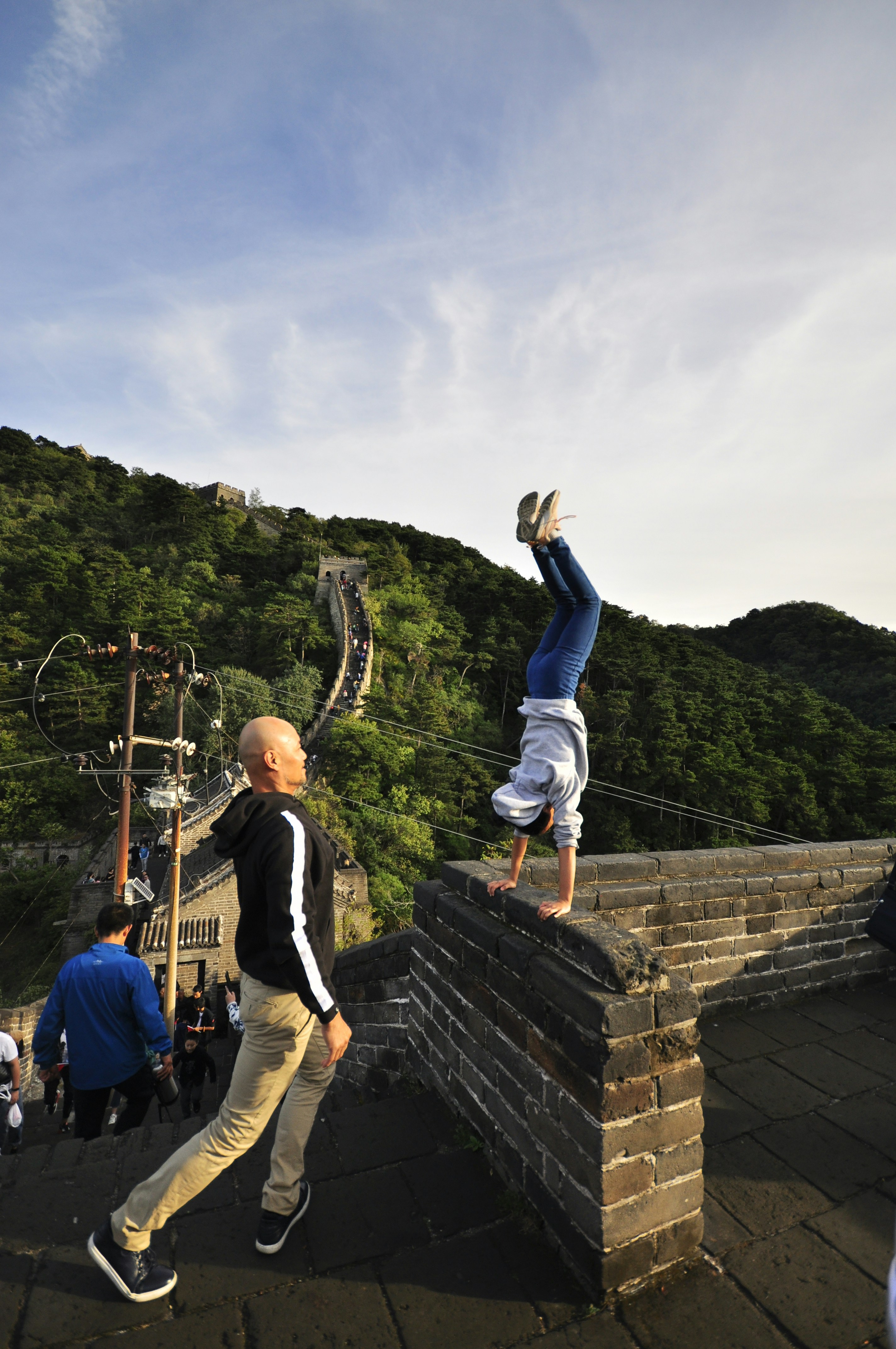 Balancing Act on the Great Wall: A Street-Performance Moment
