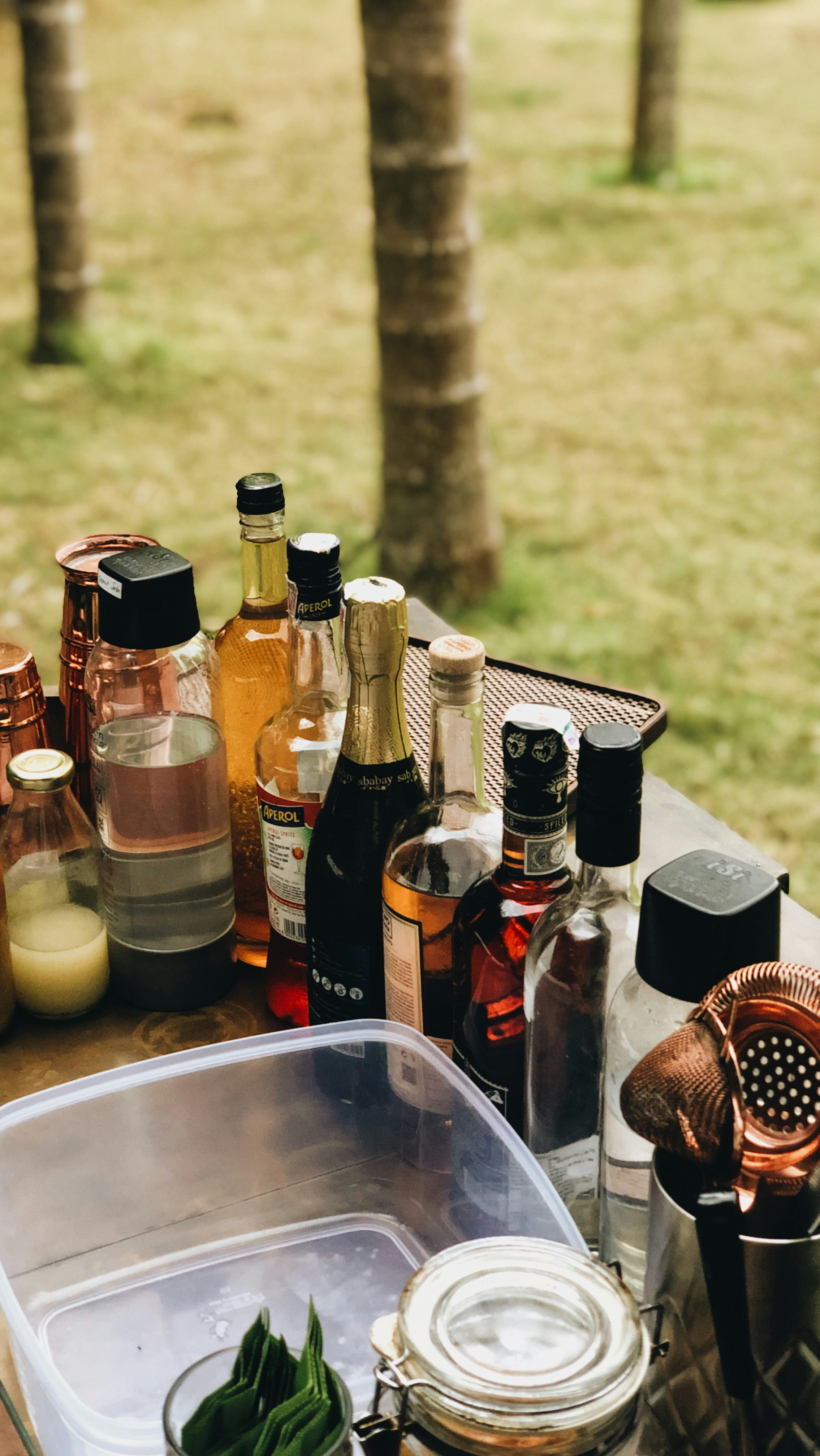 a table topped with lots of bottles of liquid