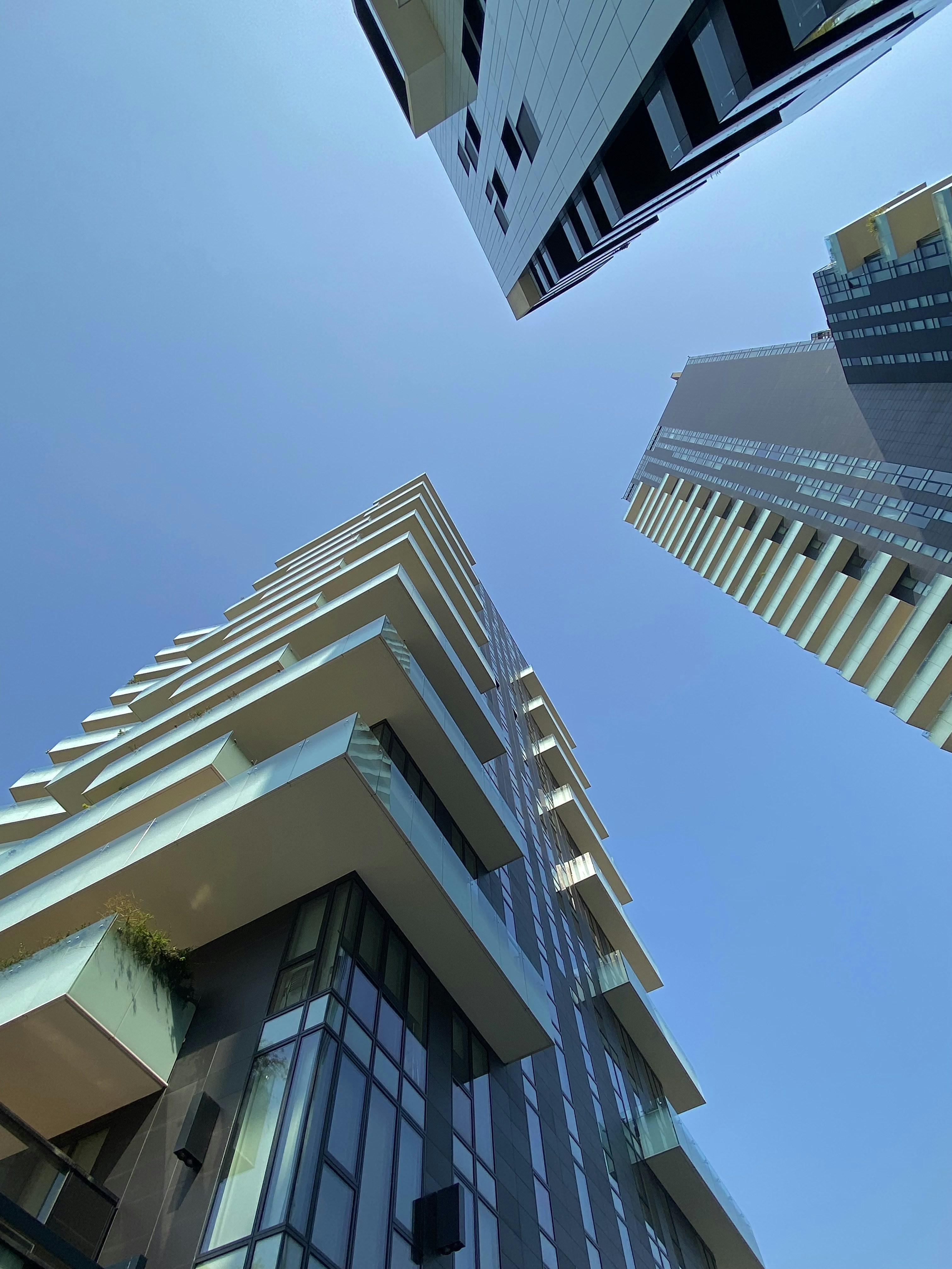 Looking up at tall buildings in a city photo – Free Milano Image on ...