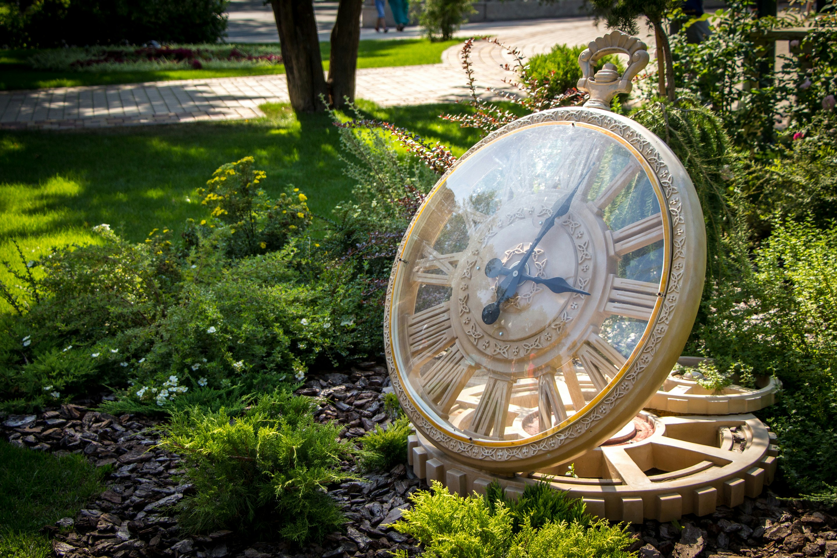 Tilted Clockwork Garden: A Gleaming Globe Among Greenery