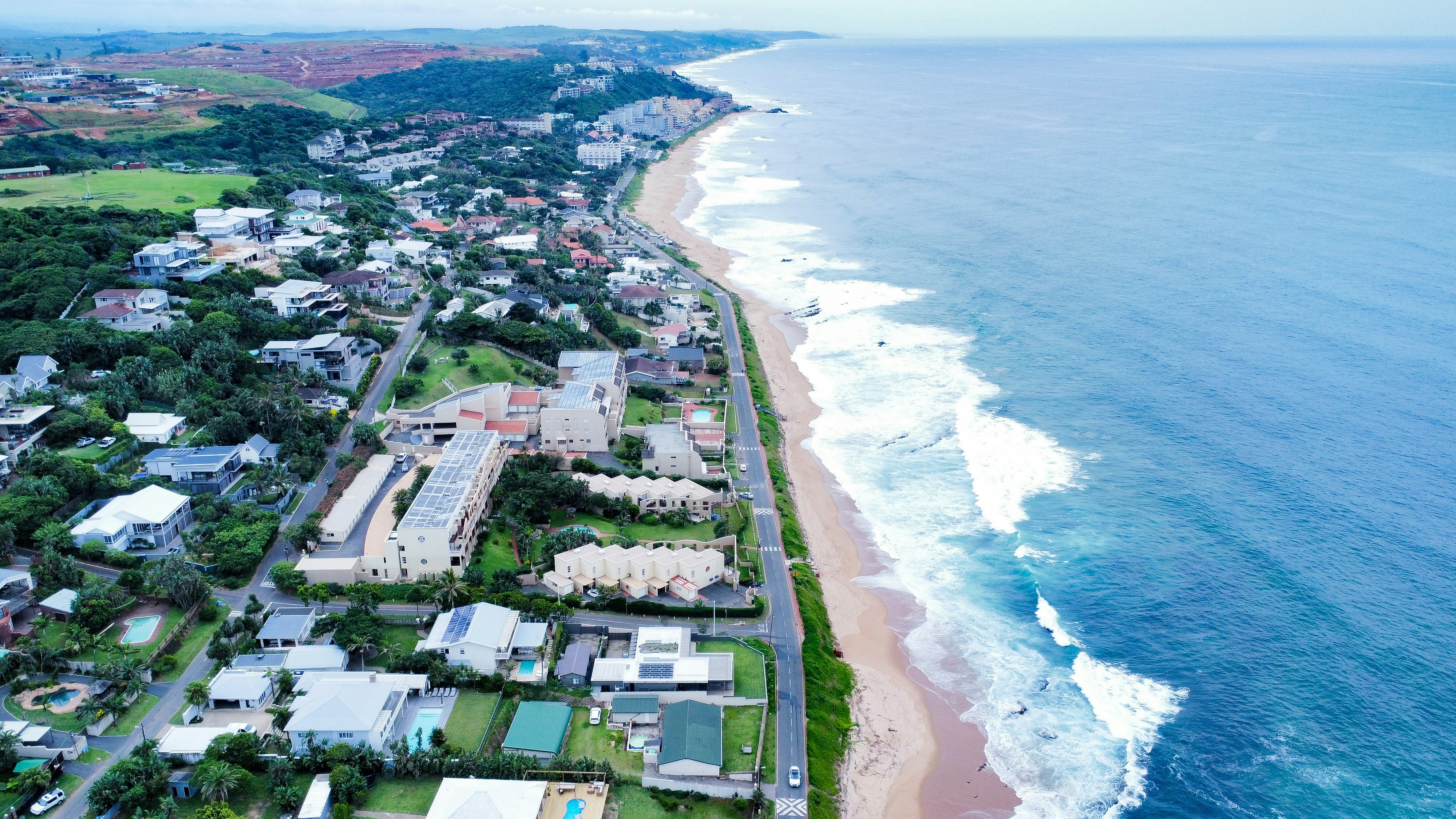 A bird's eye view of a beach and ocean photo – Free Umdloti beach Image ...