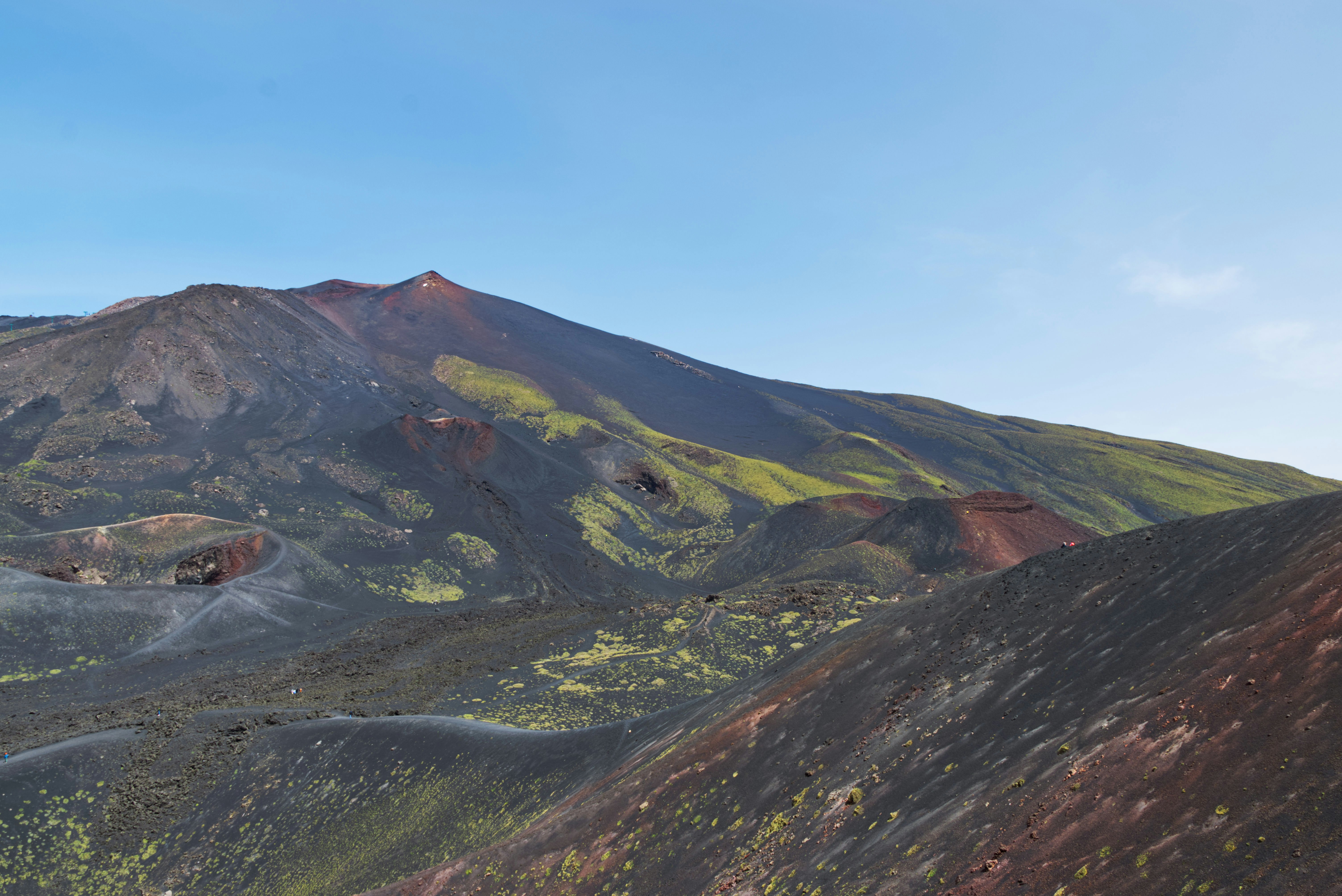 a view of a mountain range with a blue sky in the backgroundAnastasiya Dalenka