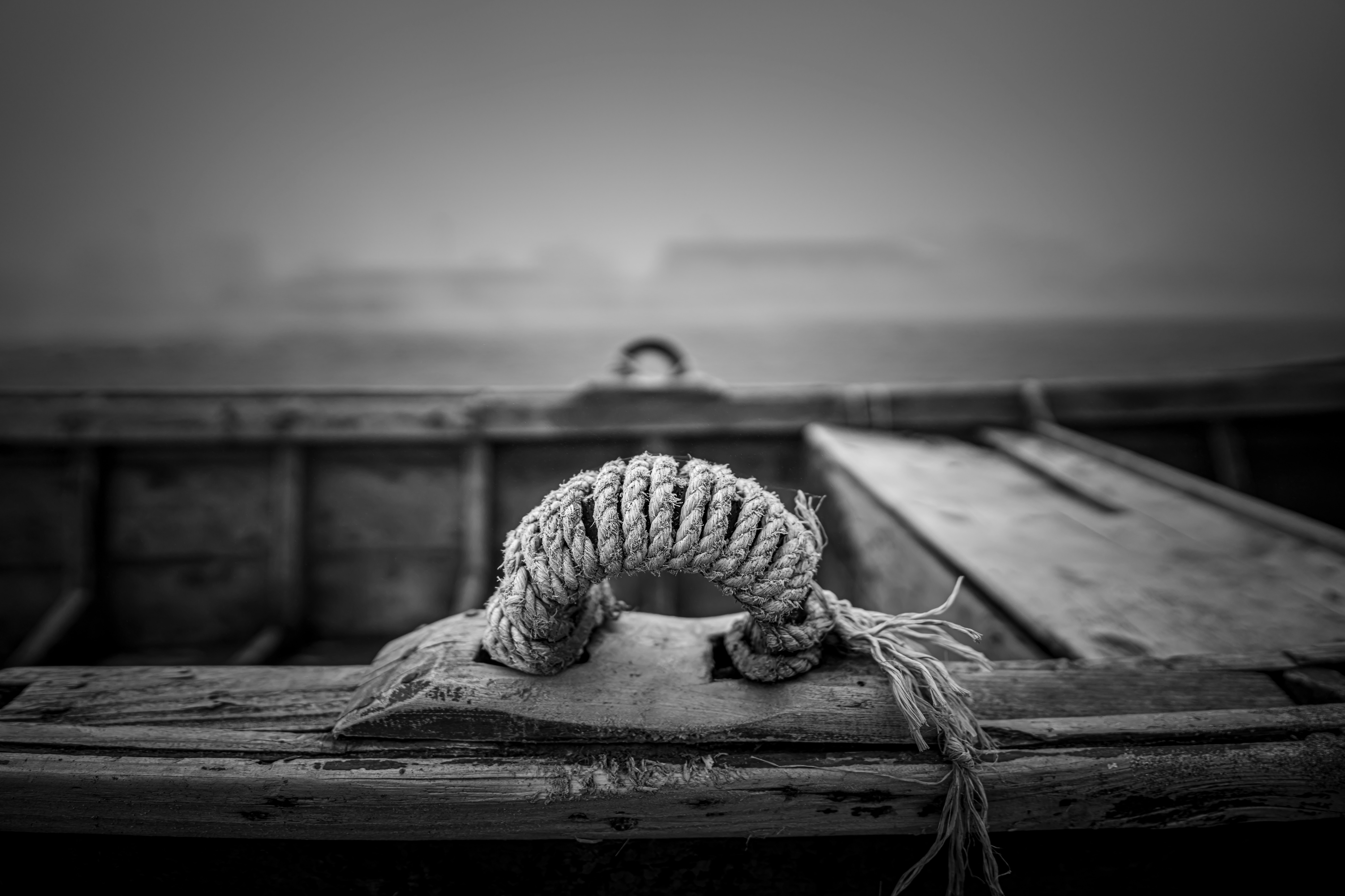 Weathered Rope Loop Anchors a Monochrome Dockscape