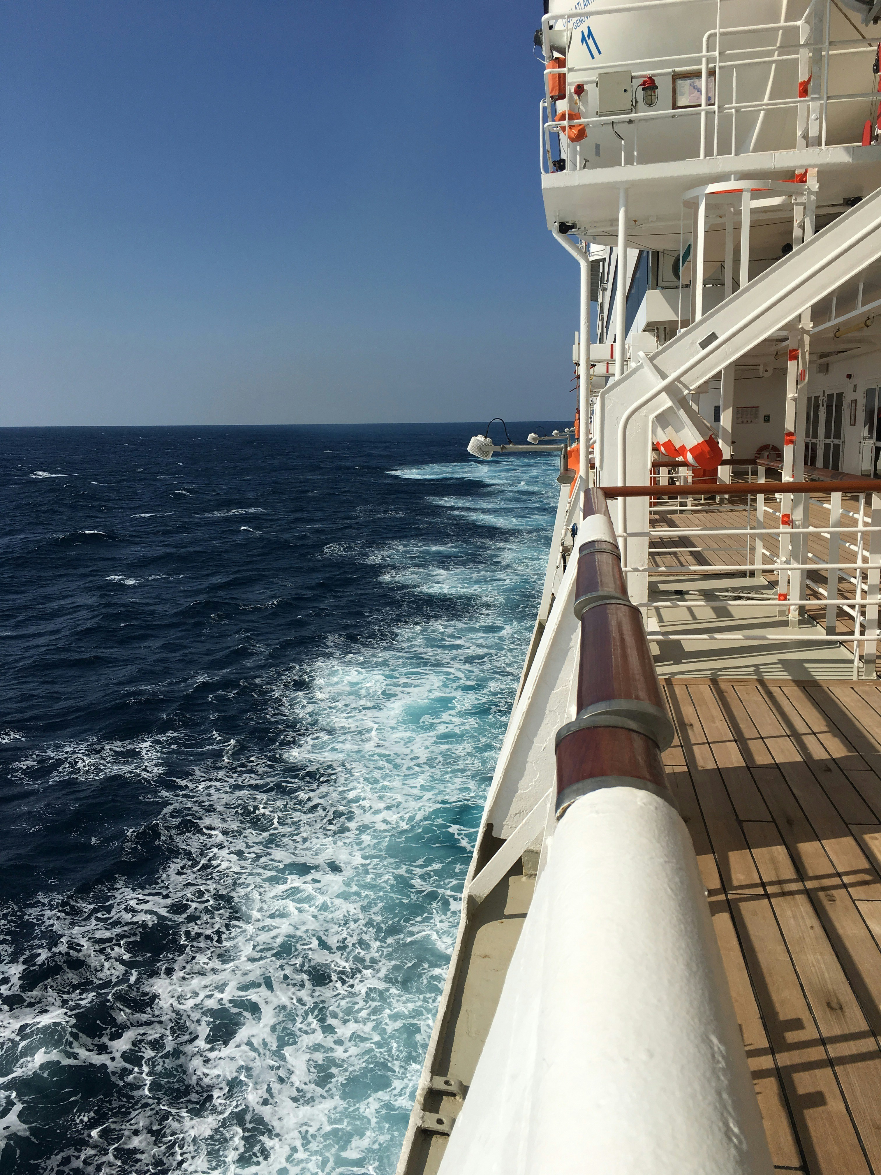 A large white pipe on the side of a ship photo – Free Grey Image on ...