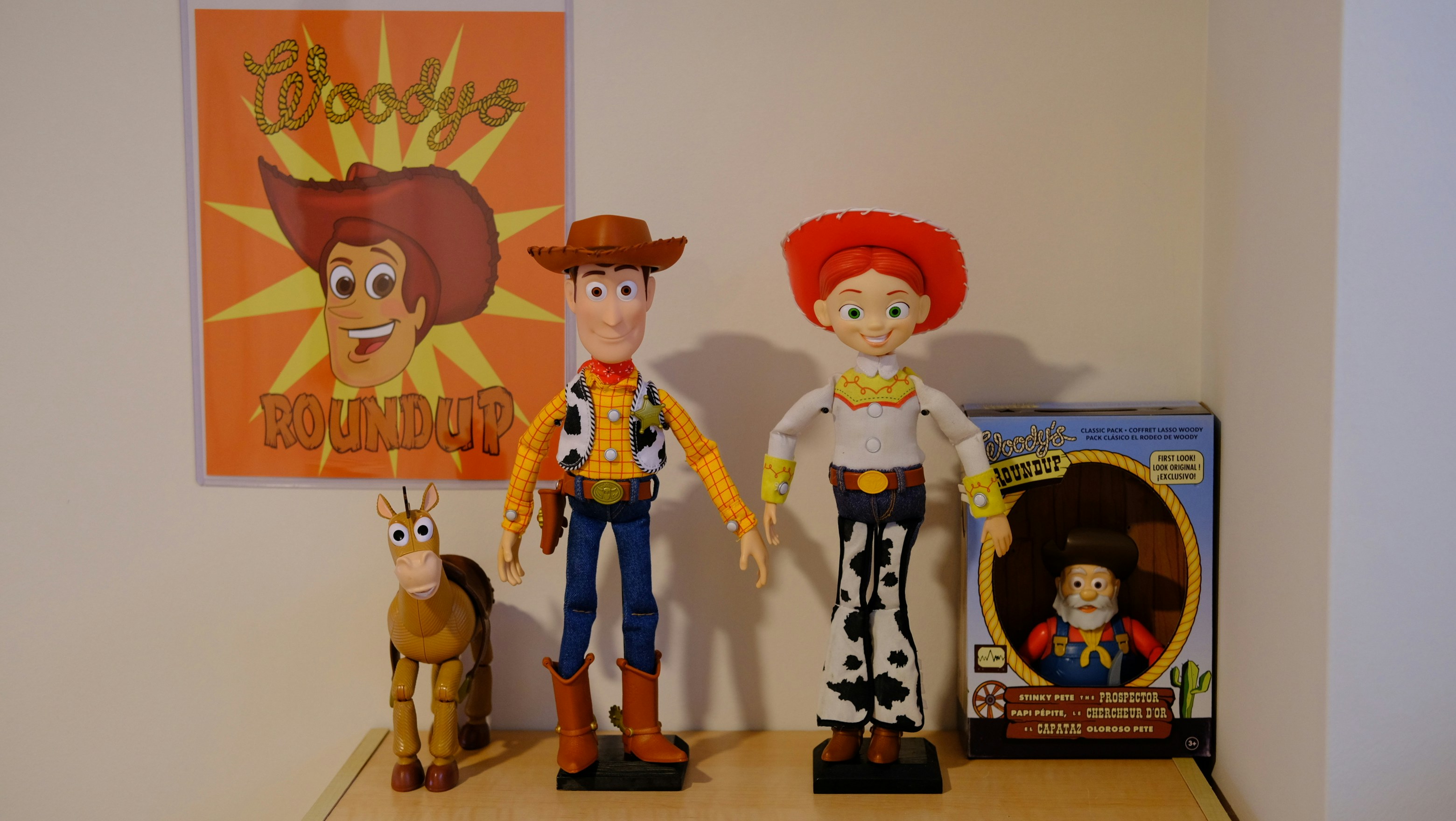 A couple of toy figurines sitting on top of a shelf photo – Free Toy ...