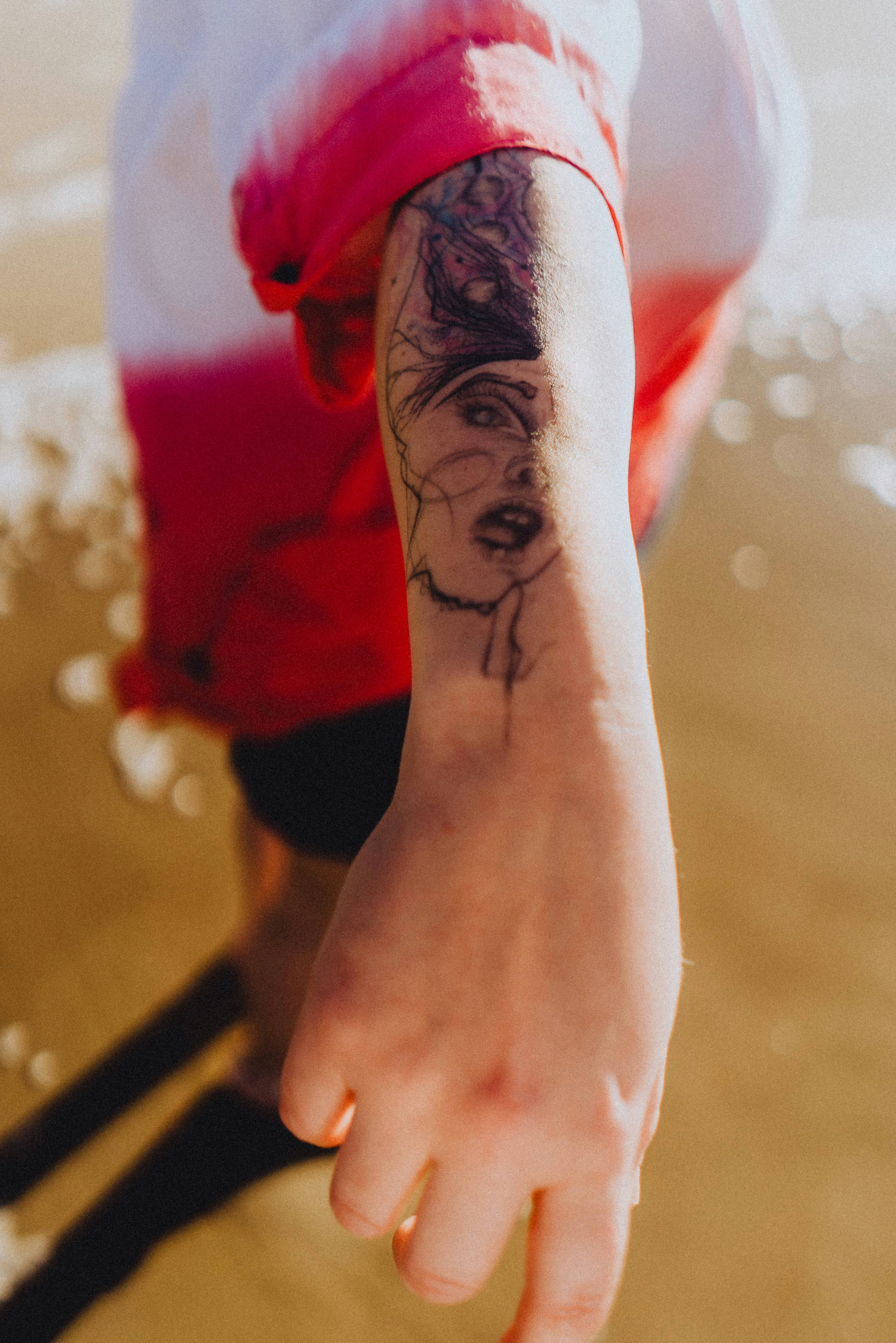 a person with a tattoo on their arm