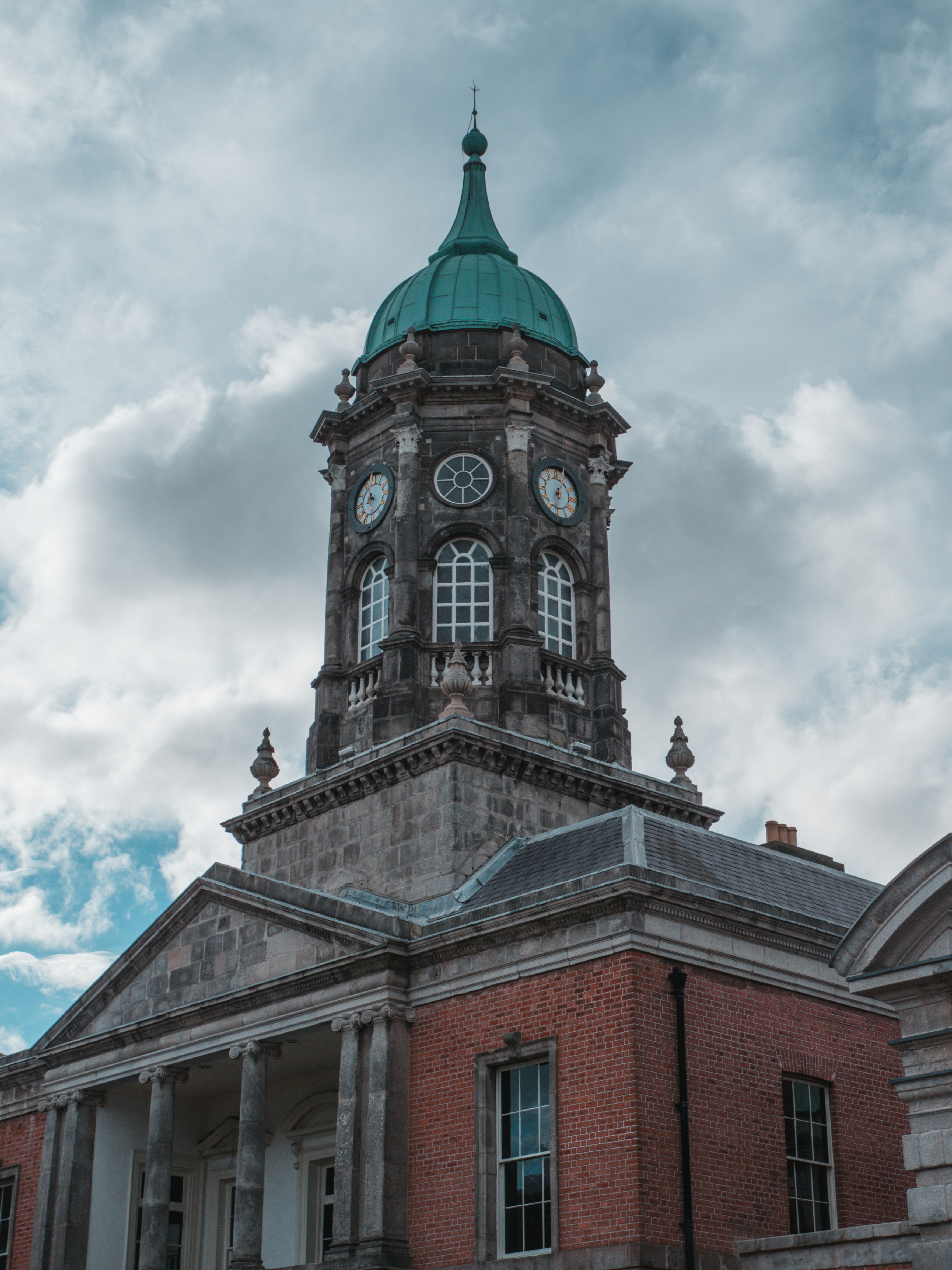 A clock tower on top of a building photo – Free Château de dublin Image ...