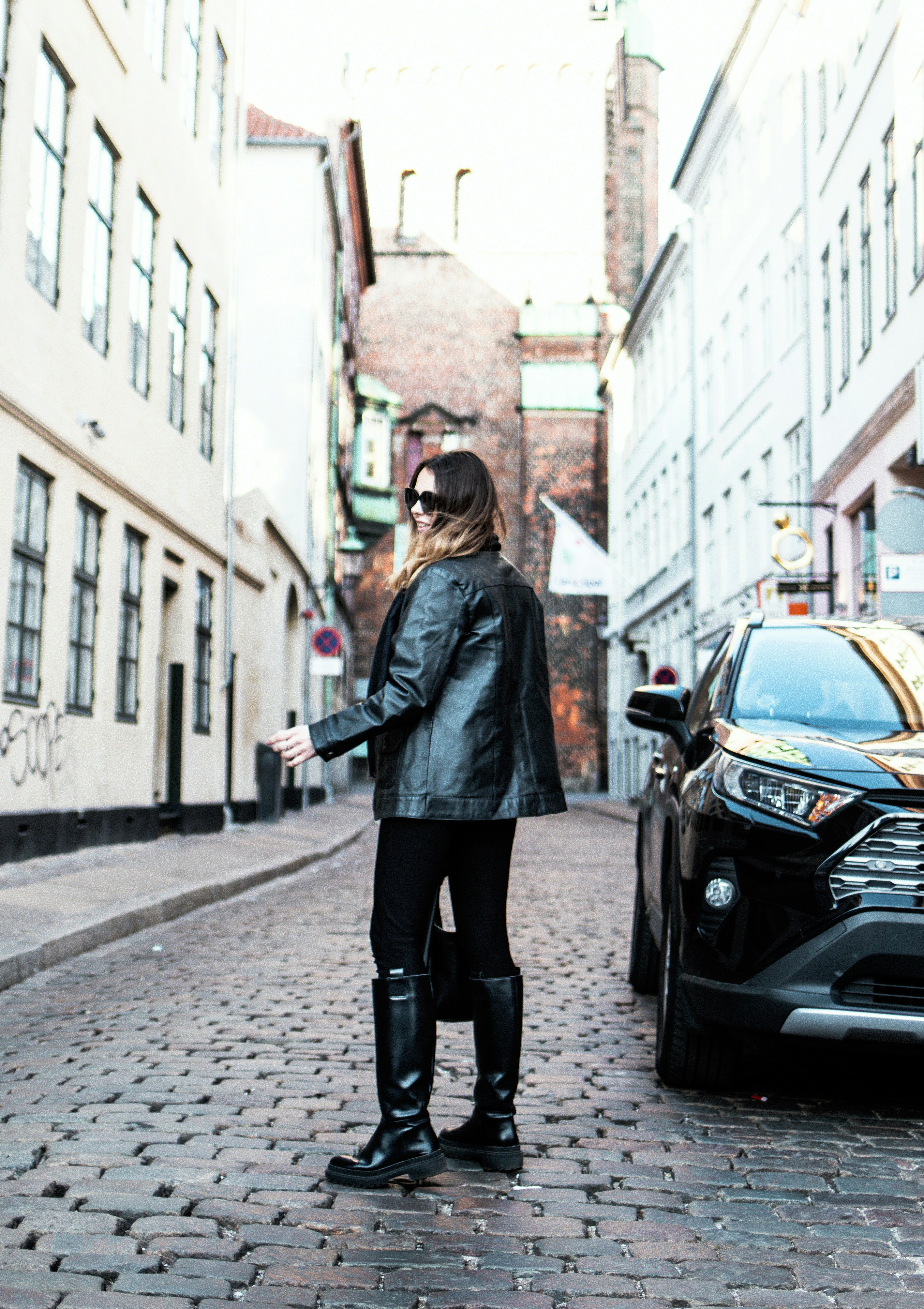 Leather Echoes Down the Cobblestone Alley