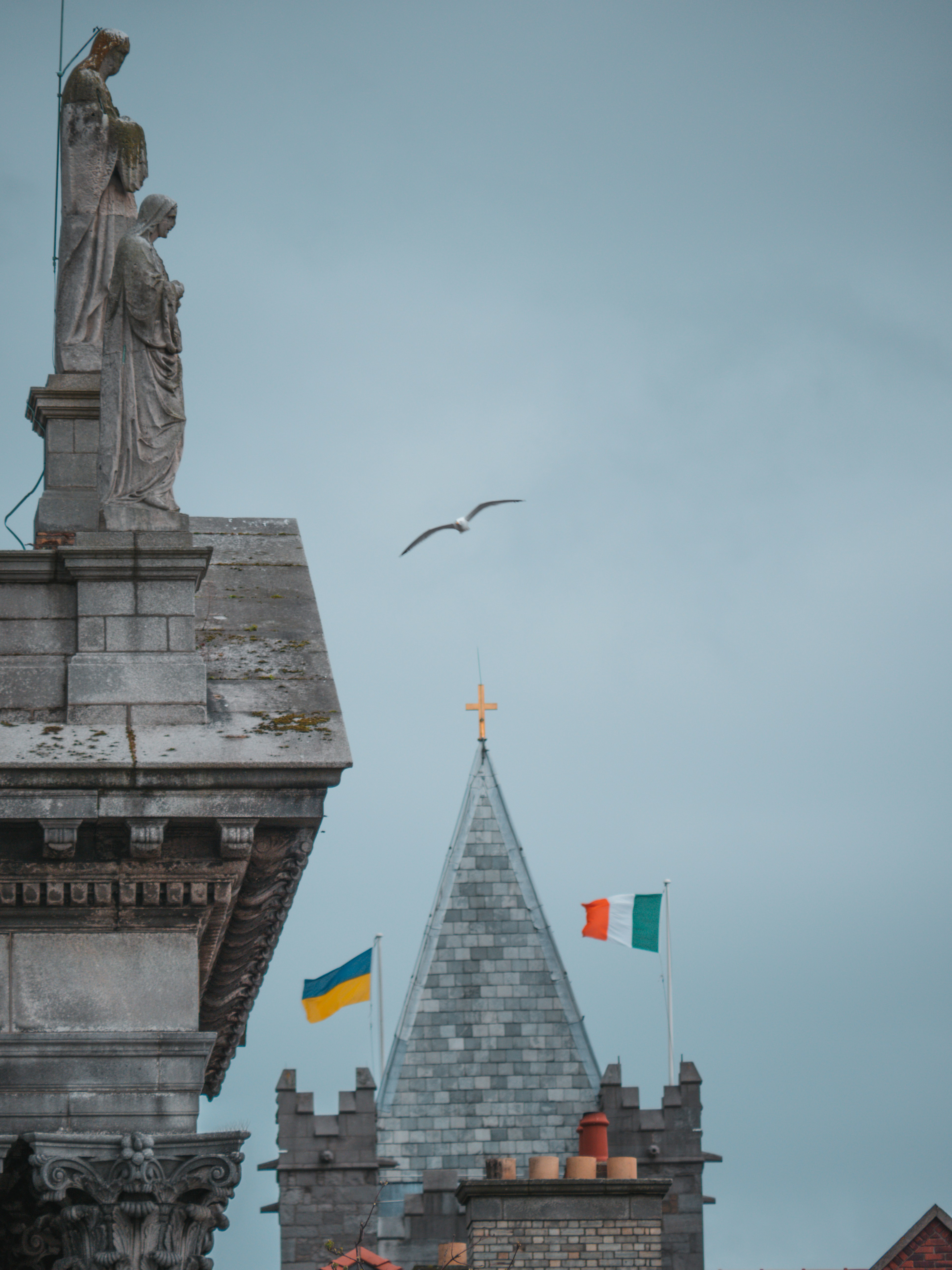 a statue of a woman on top of a building
