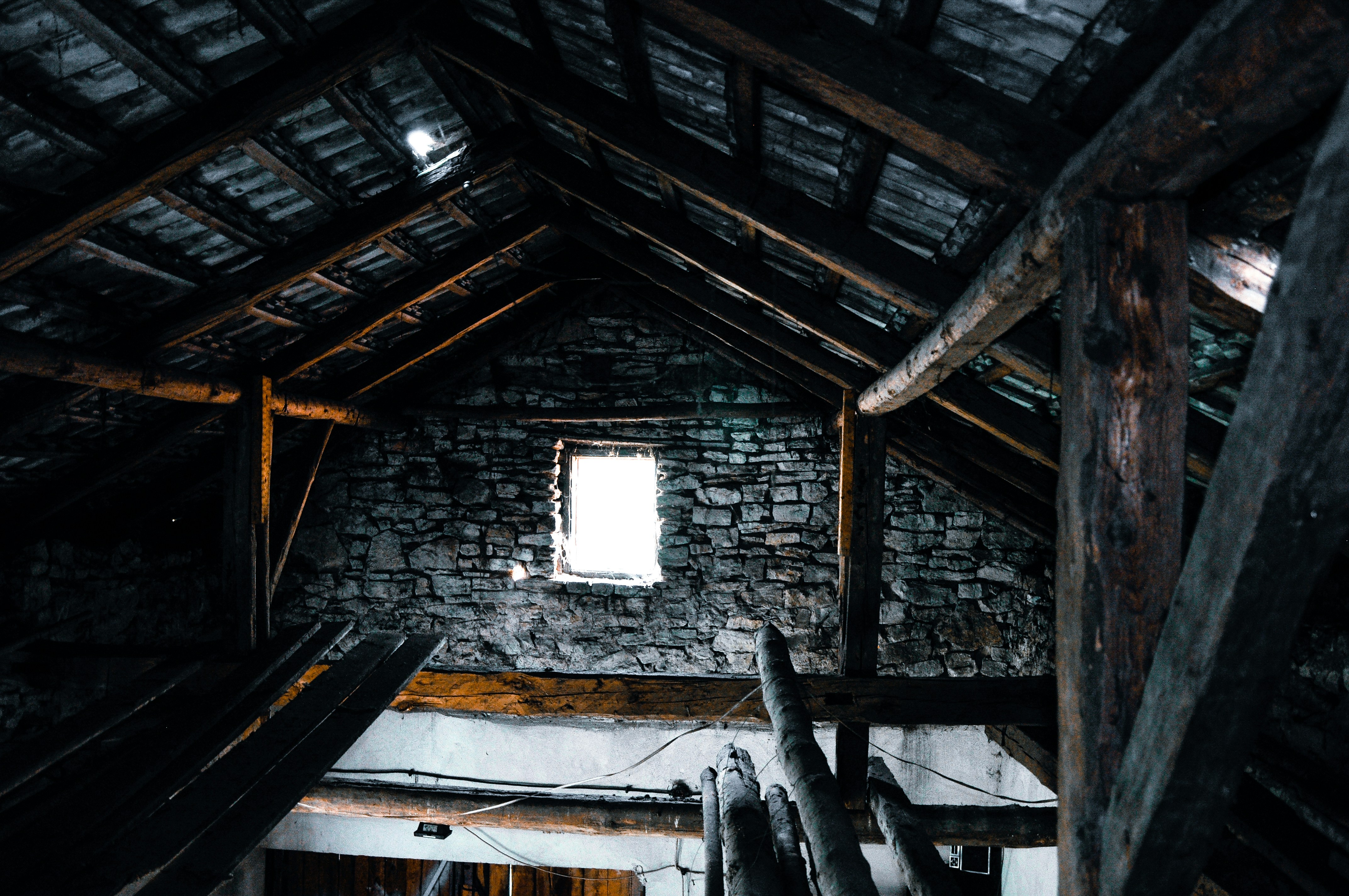 A loft with exposed wood and stone walls photo – Free Lost place Image ...