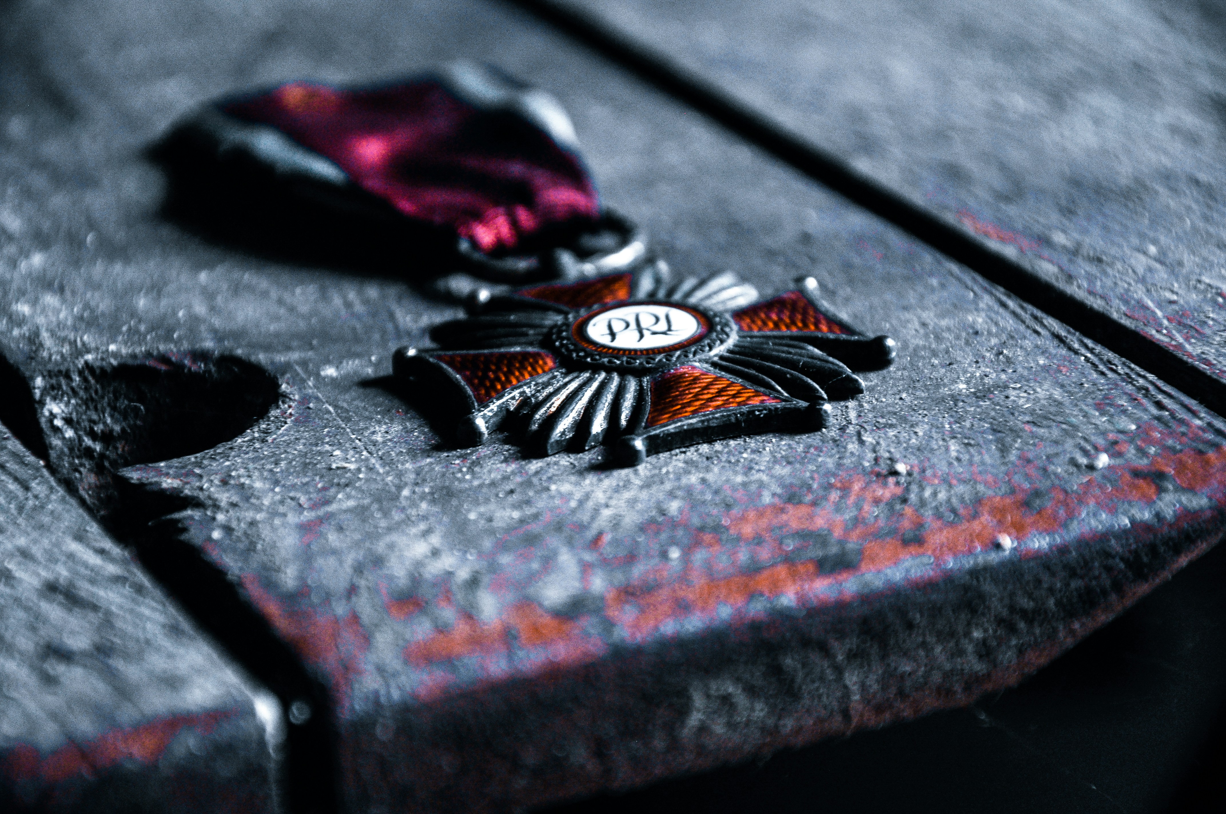a medal laying on top of a wooden table