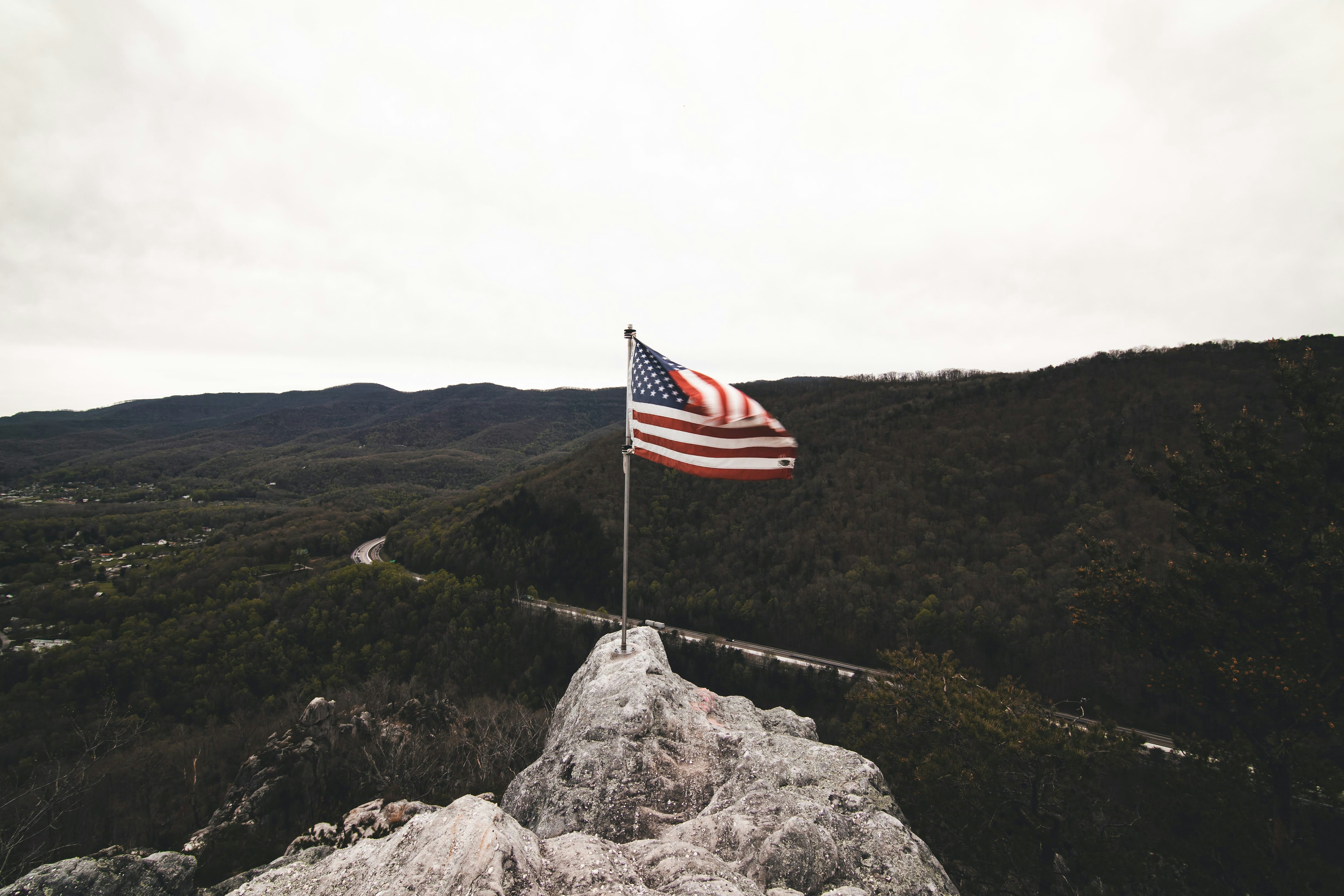 Granite Spire Anthem: American Flag Above the Valley