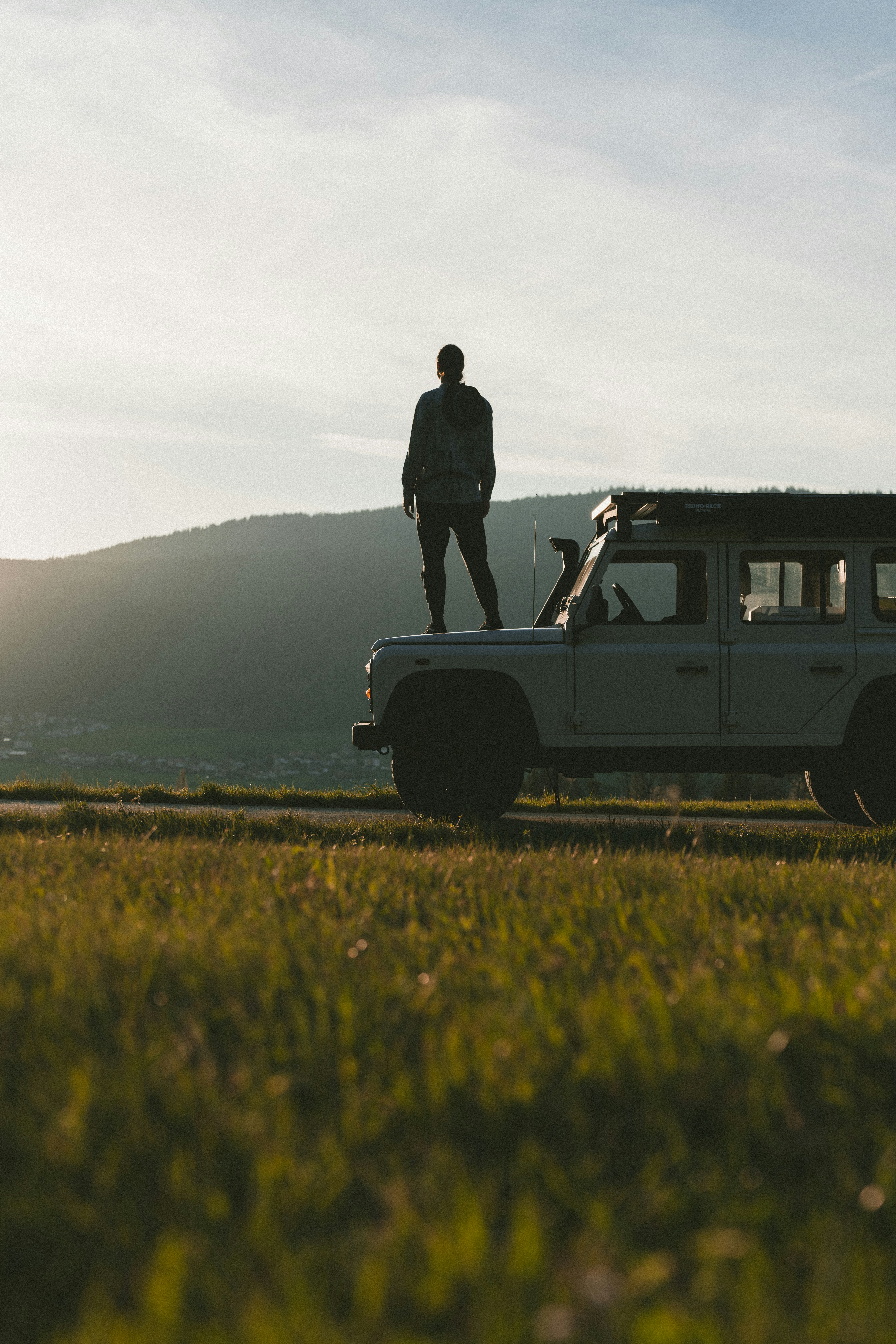 Dusk Sentinel on a Defender: A Lone Figure Commands the Horizon