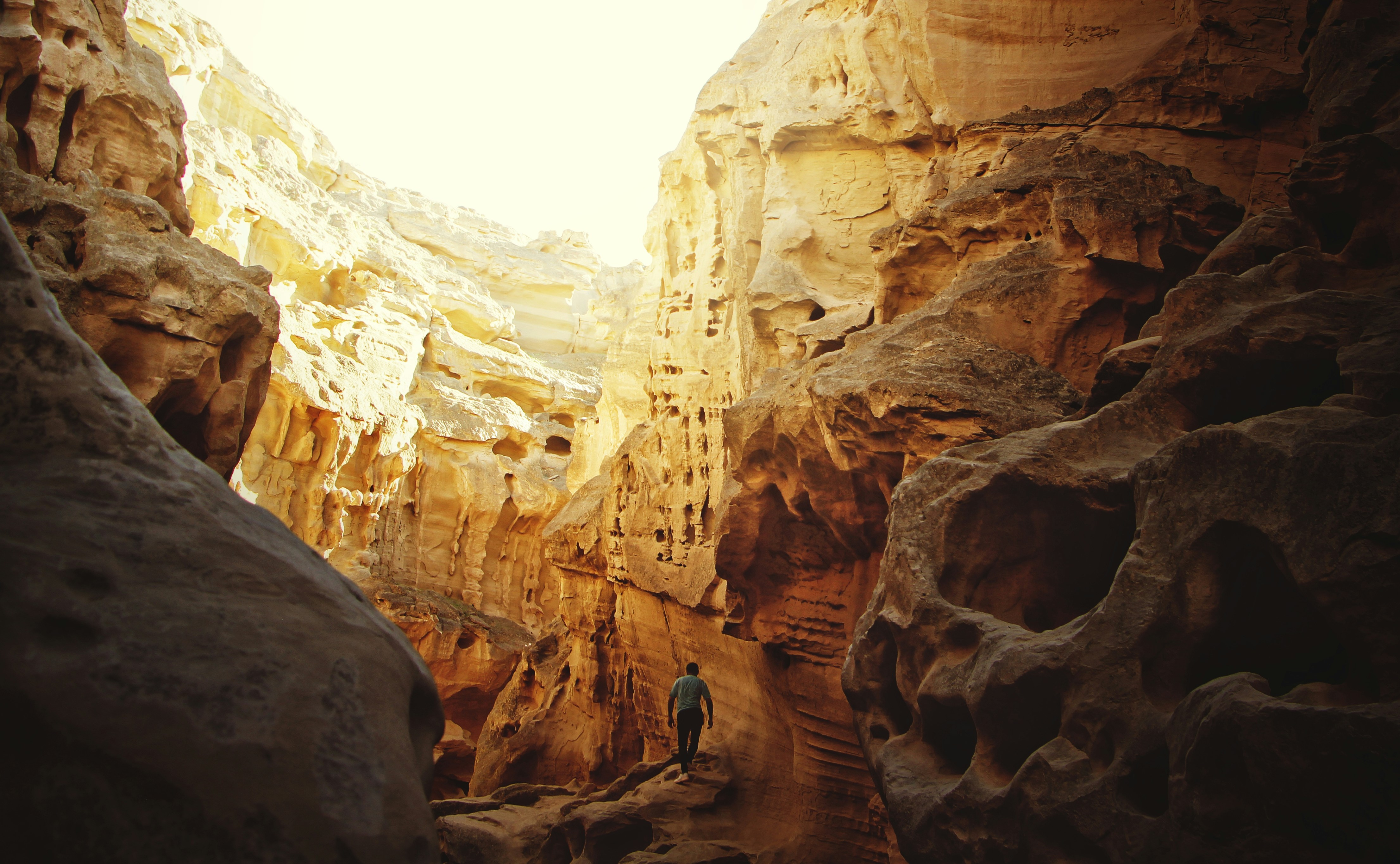 A Solo Man Climbing the Rocks