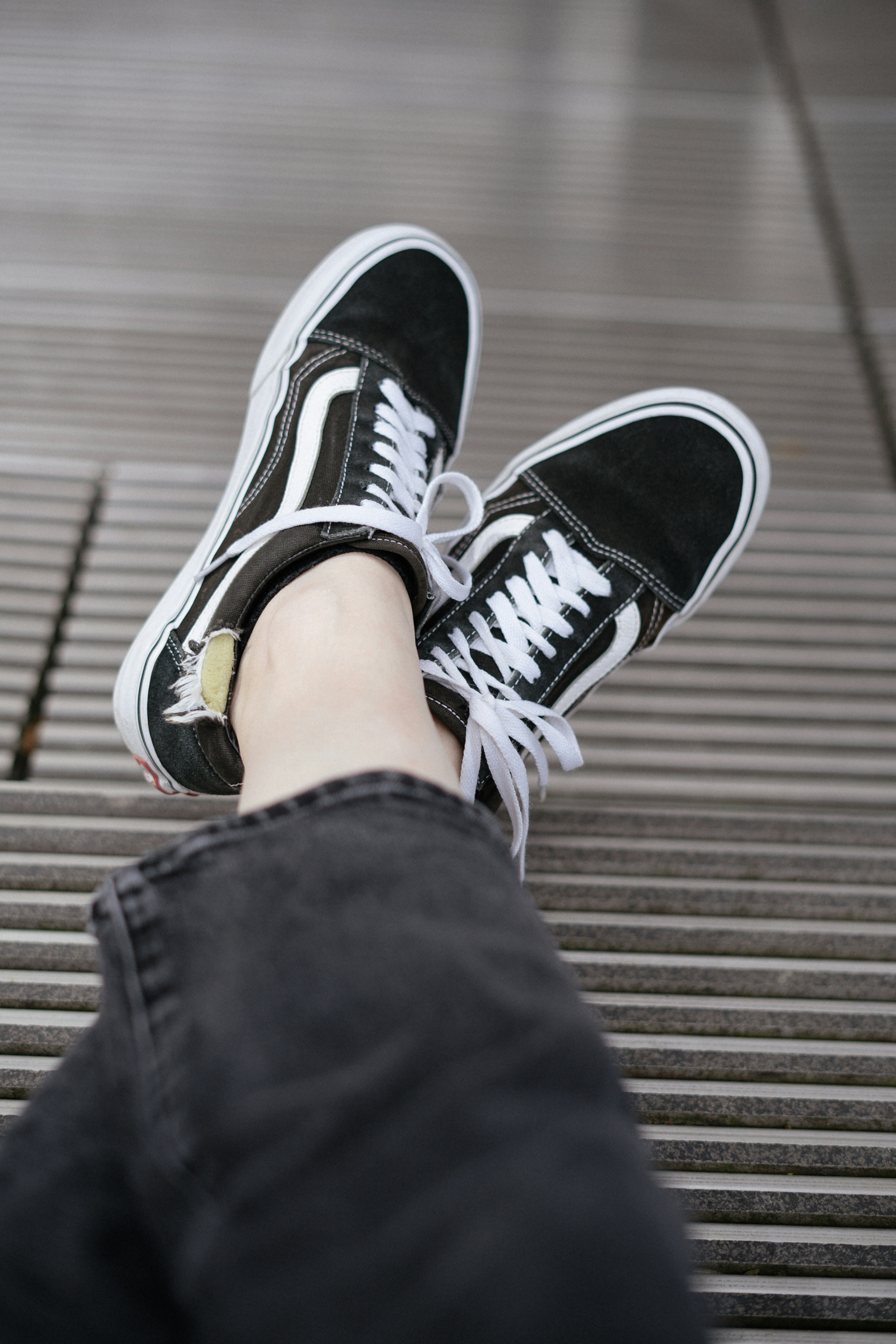 A person with black and white vans on their feet photo – Free Human ...